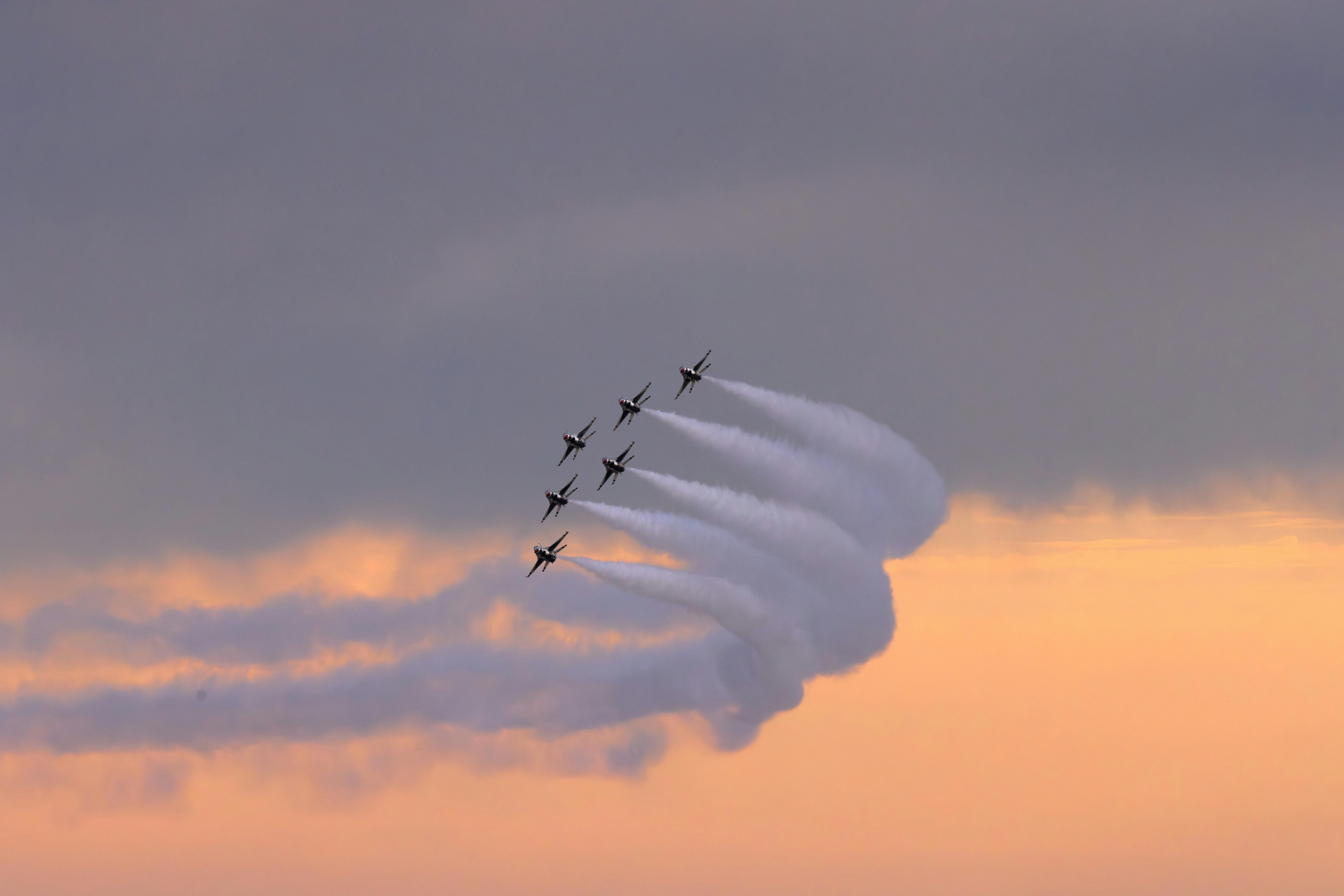Four planes flying in formation with smoke trailing behind them · Free ...