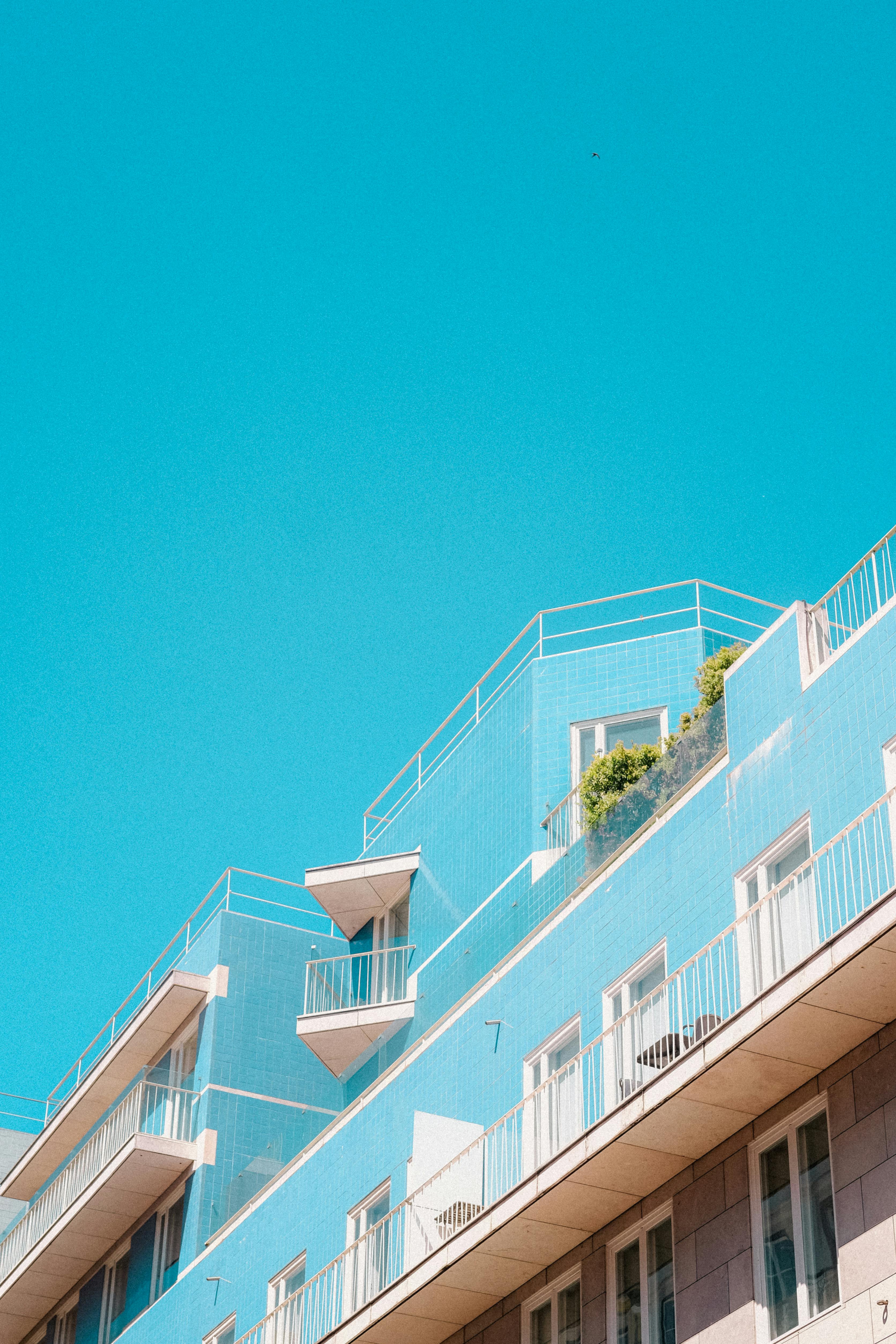Blue Apartment Building with Balconies · Free Stock Photo