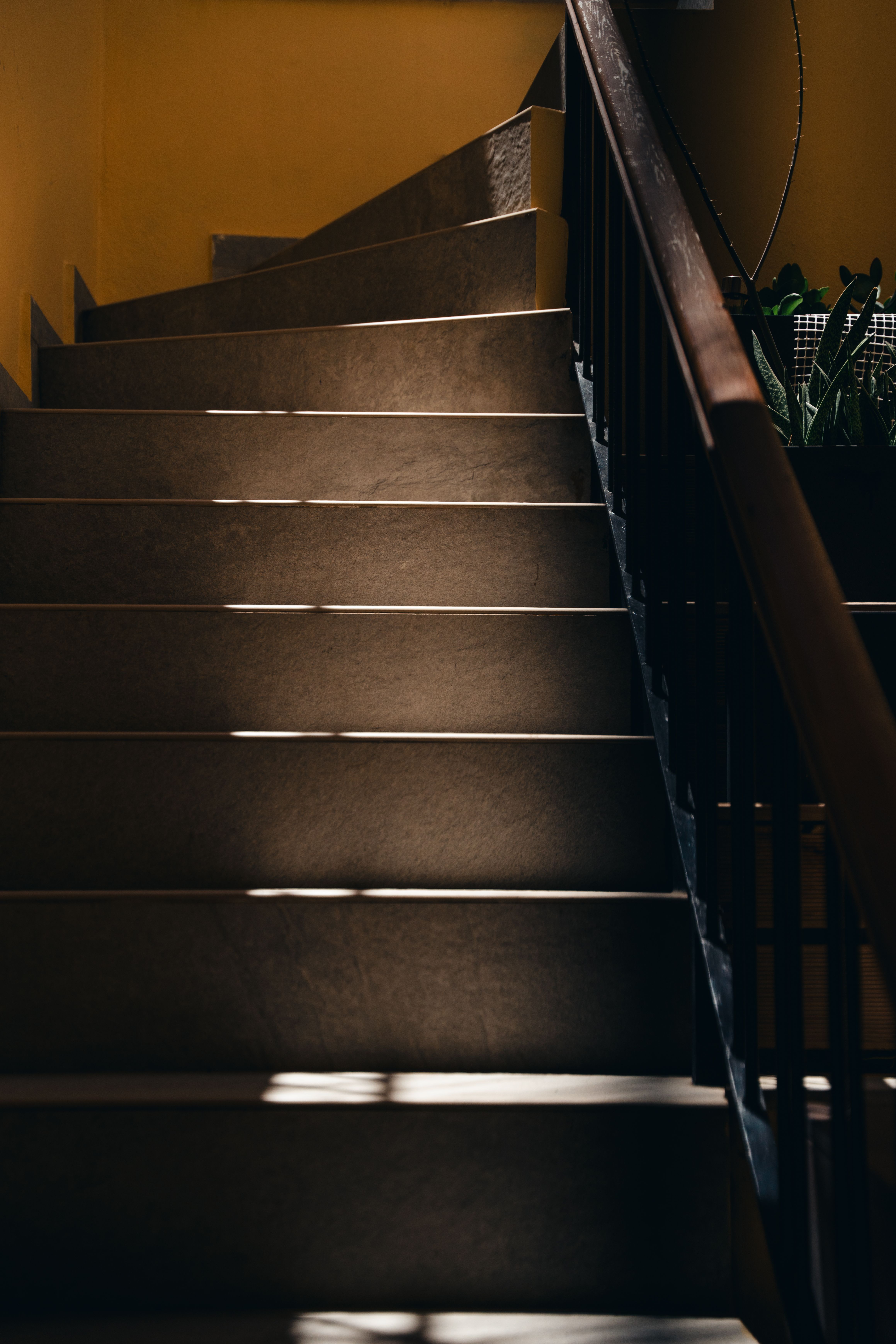 A stairway with sunlight coming through the window · Free Stock Photo