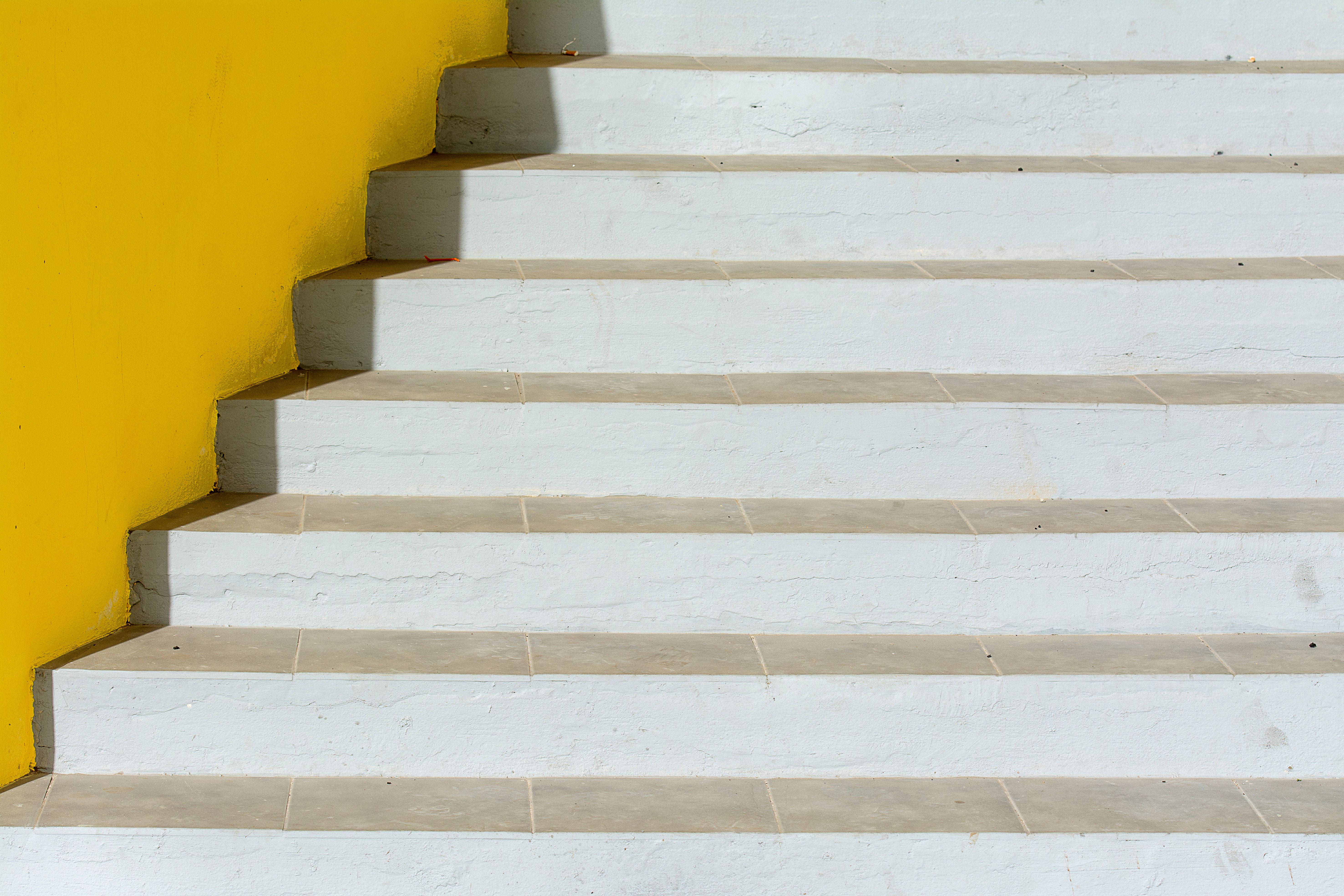 Tiled Stairs by a Yellow Wall · Free Stock Photo