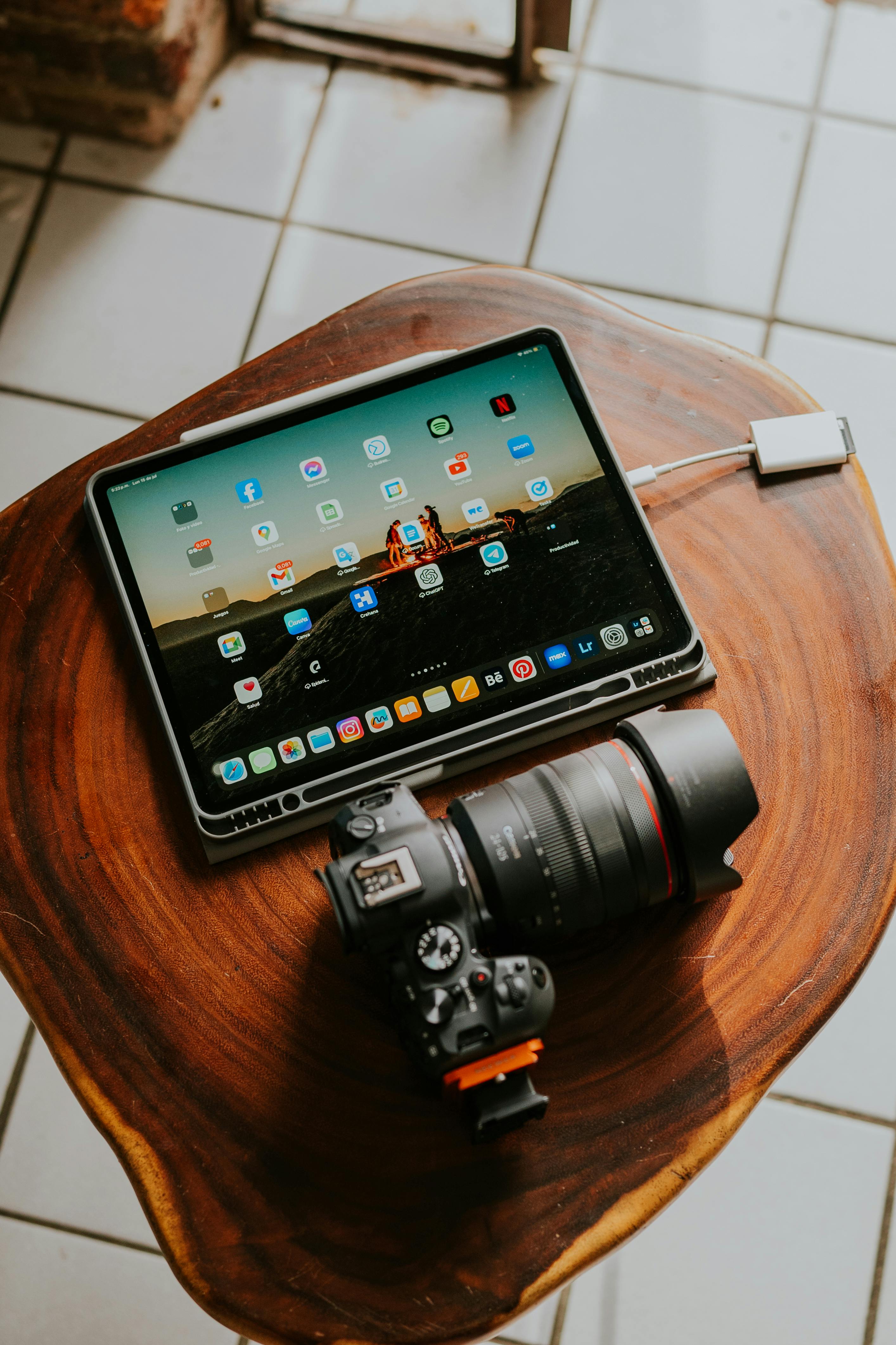 A laptop and camera on a table · Free Stock Photo