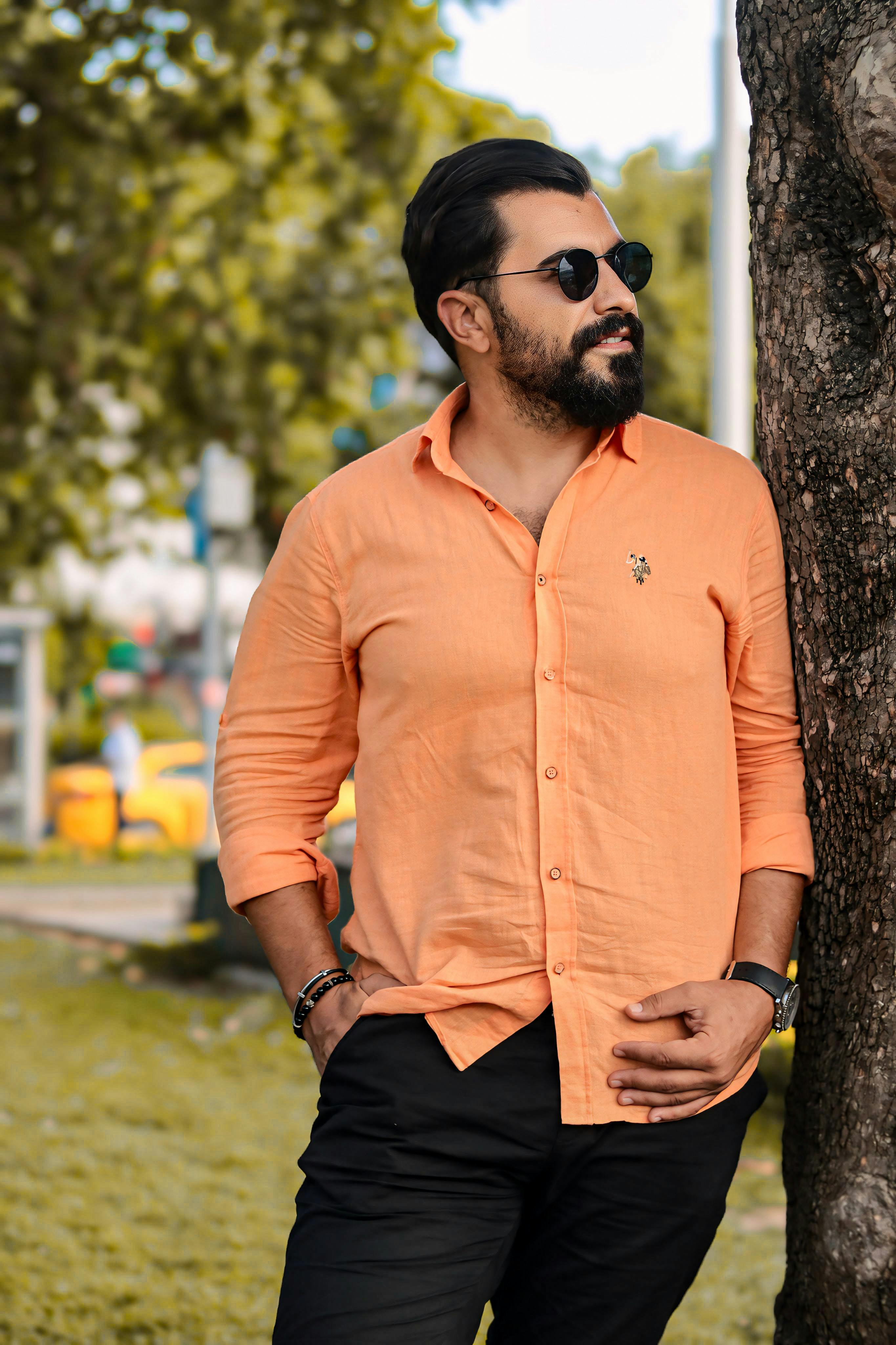 Man in Orange Shirt in a Park · Free Stock Photo