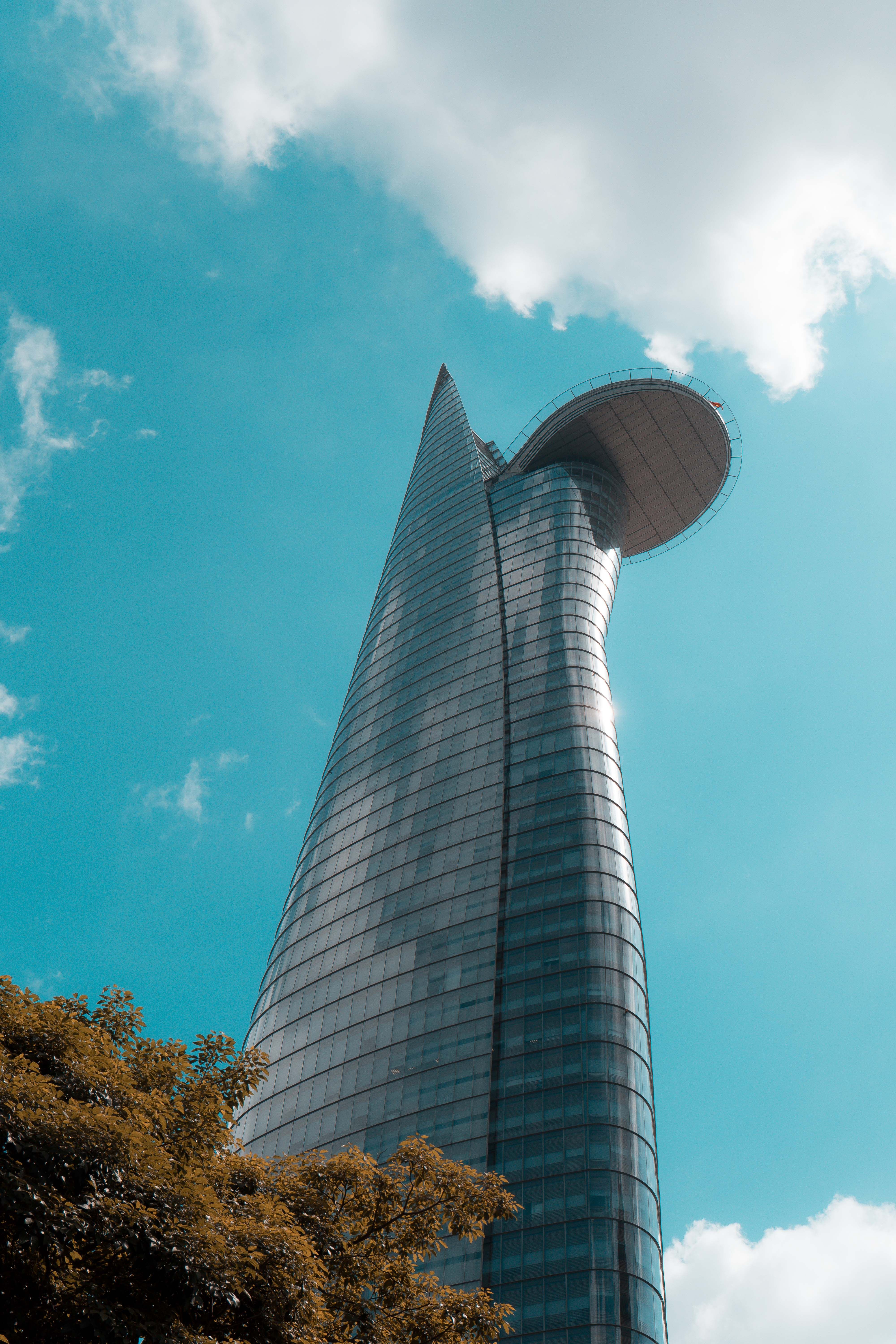 A tall building with a very tall tower · Free Stock Photo
