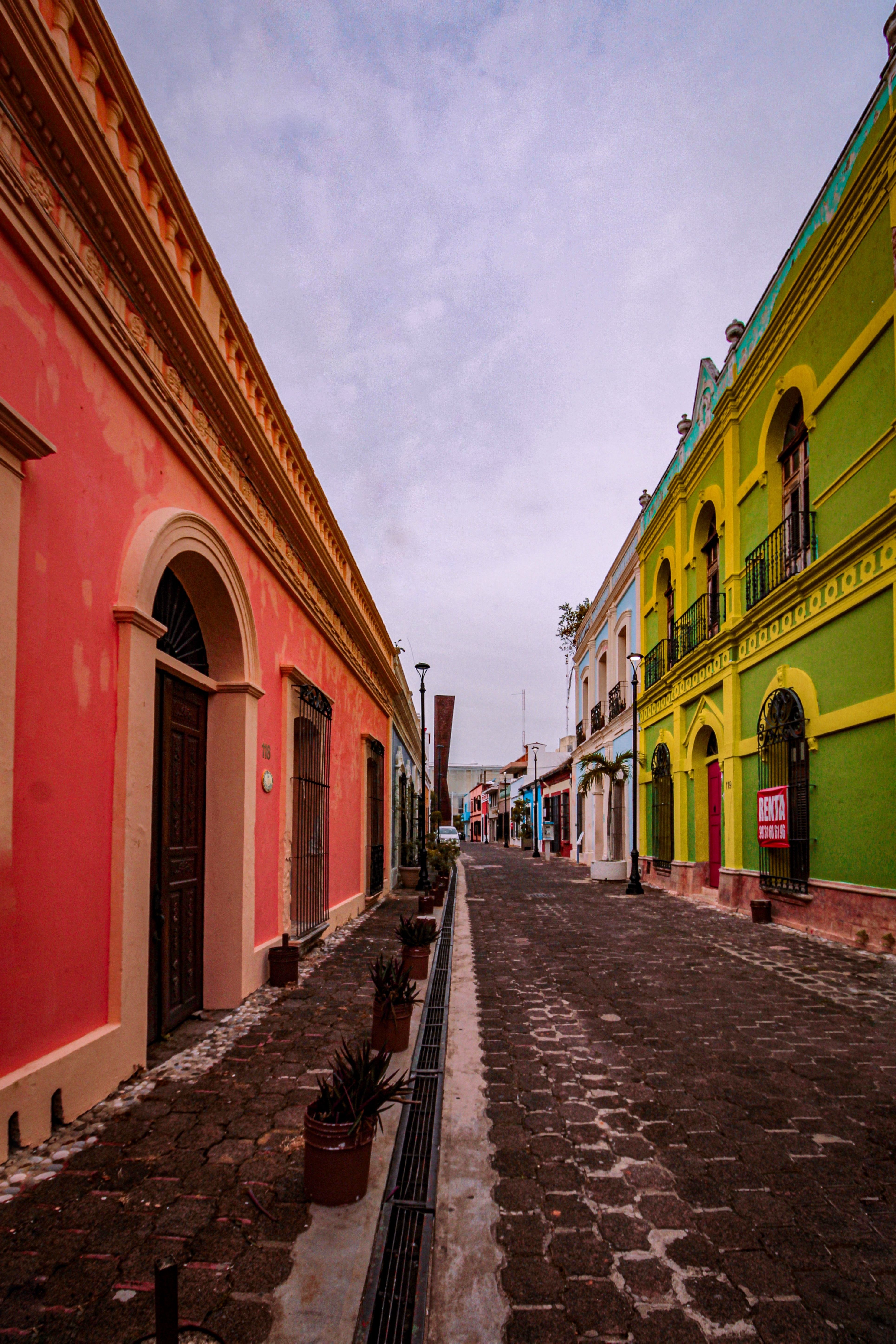A narrow street with colorful buildings and a cobblestone path · Free ...
