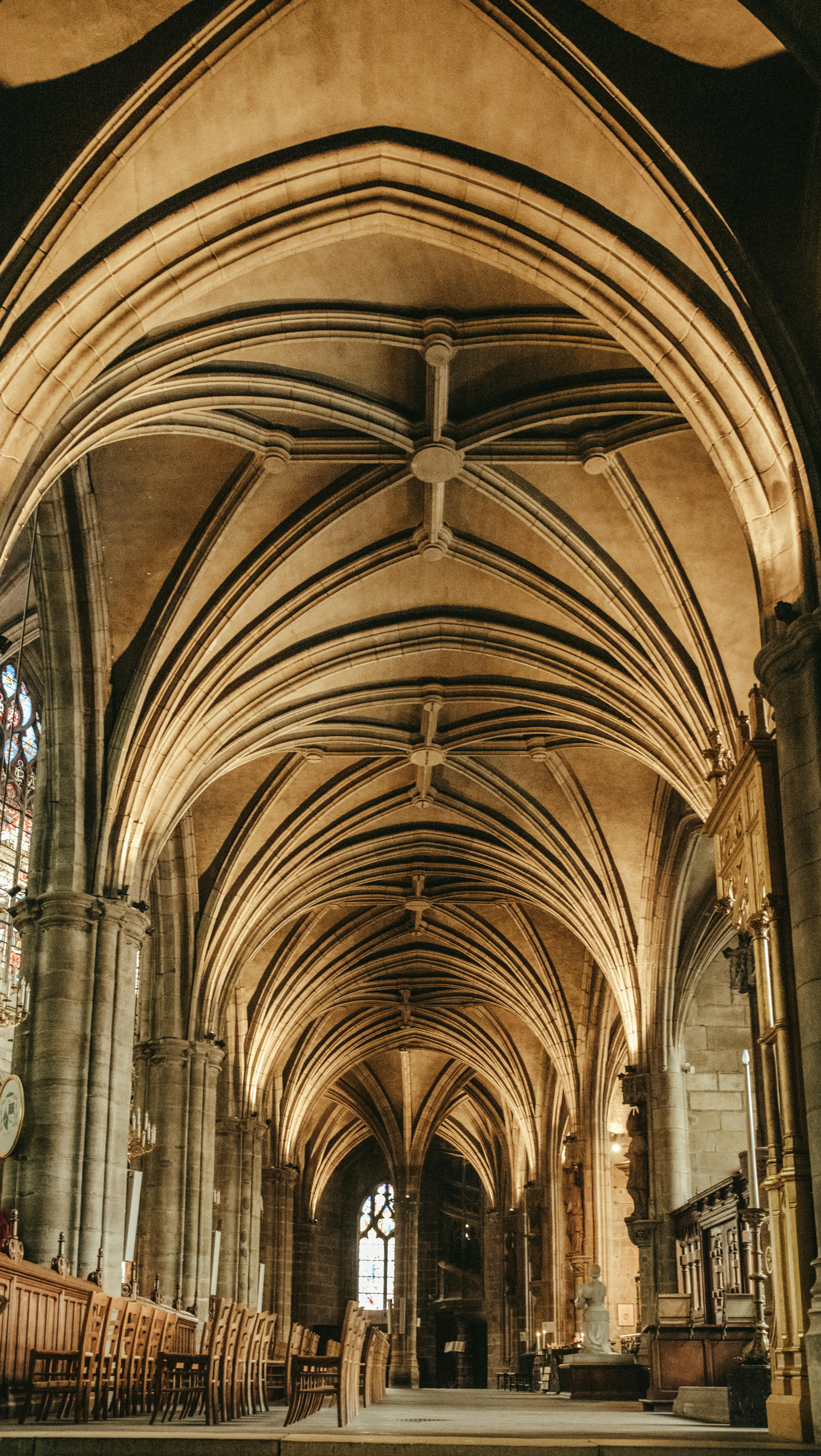 The interior of a cathedral with vaulted ceilings · Free Stock Photo