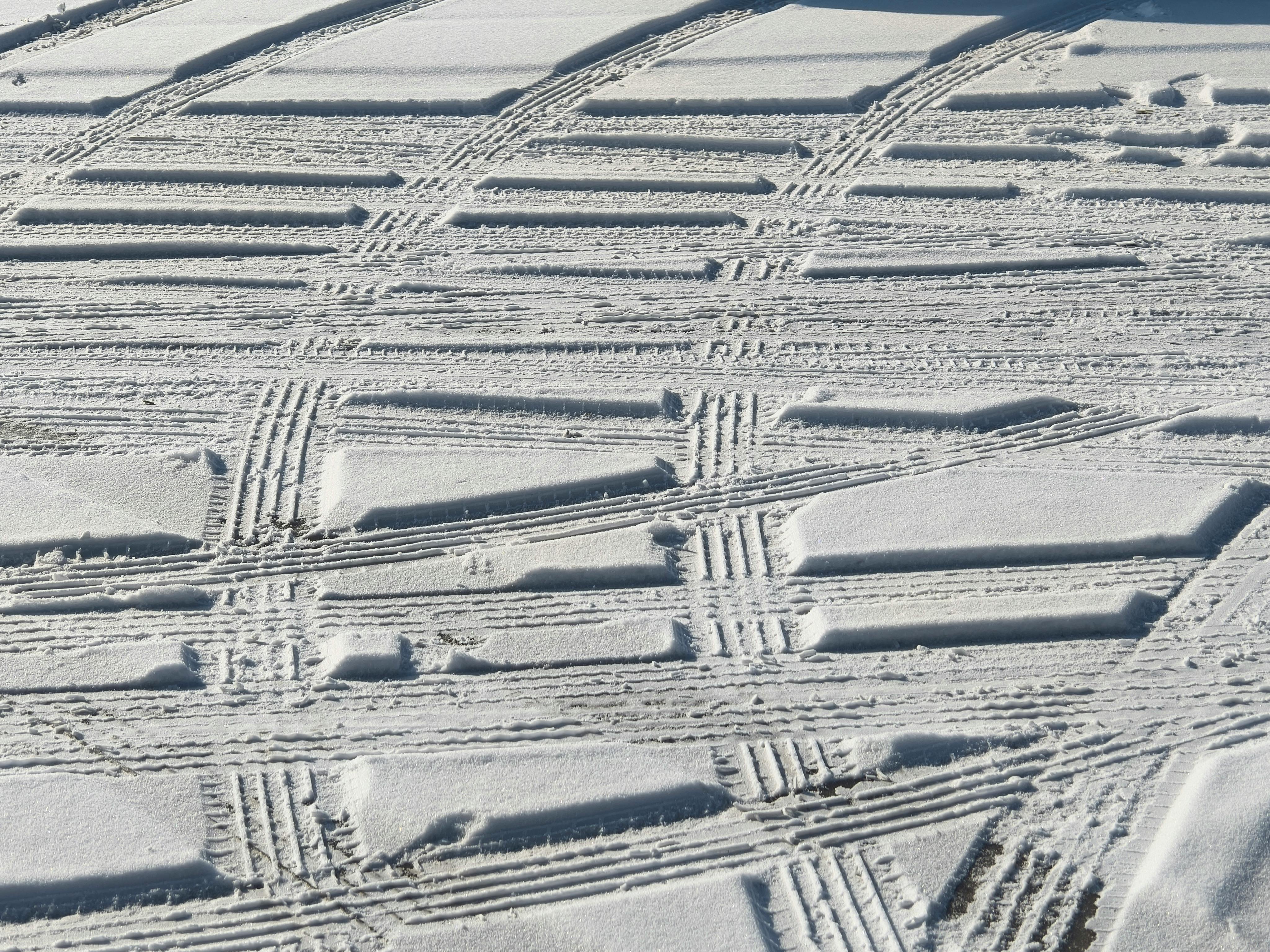 Footprints and Tire Tracks in Snowy Pathway · Free Stock Photo