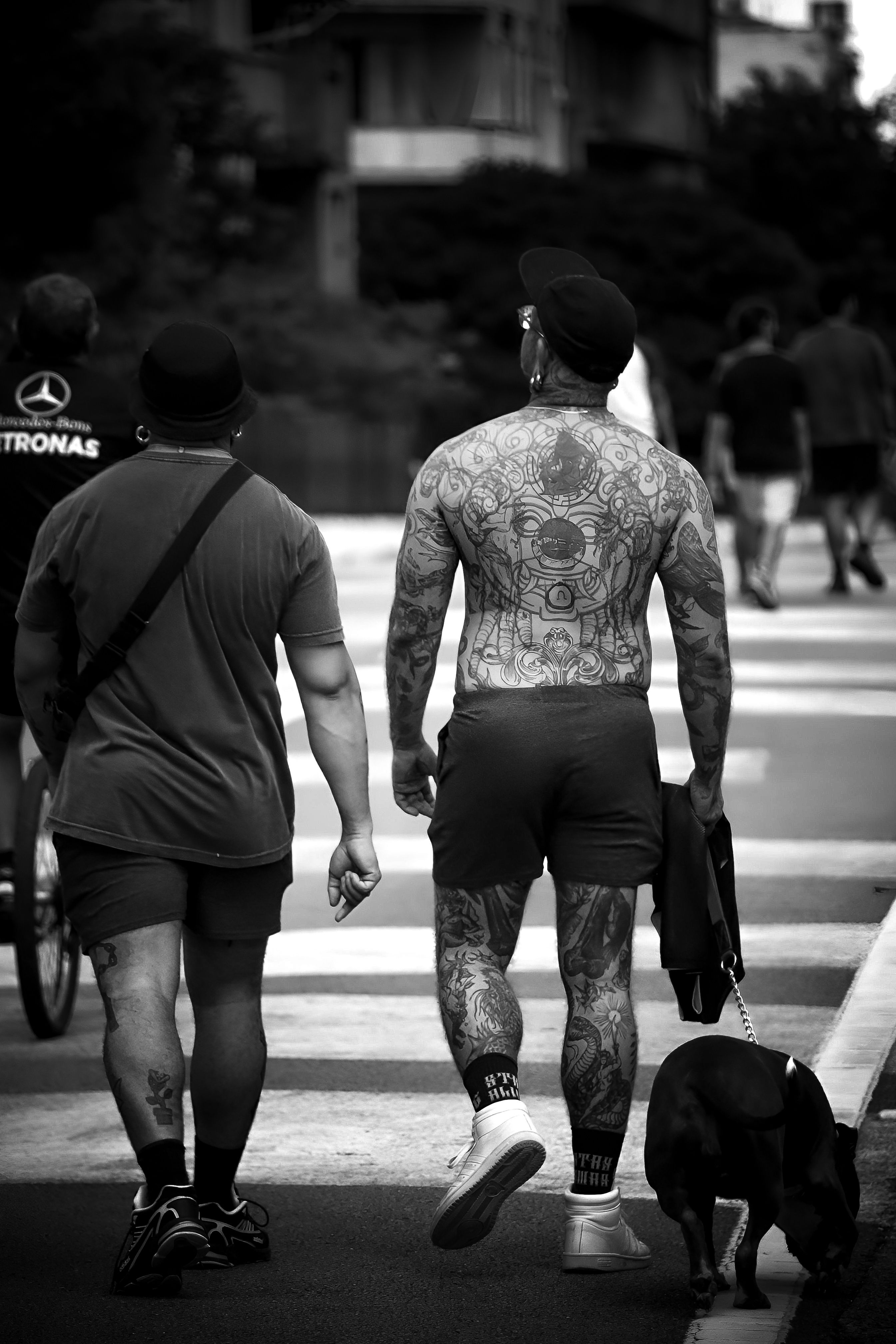 Two men walking down the street with tattoos · Free Stock Photo