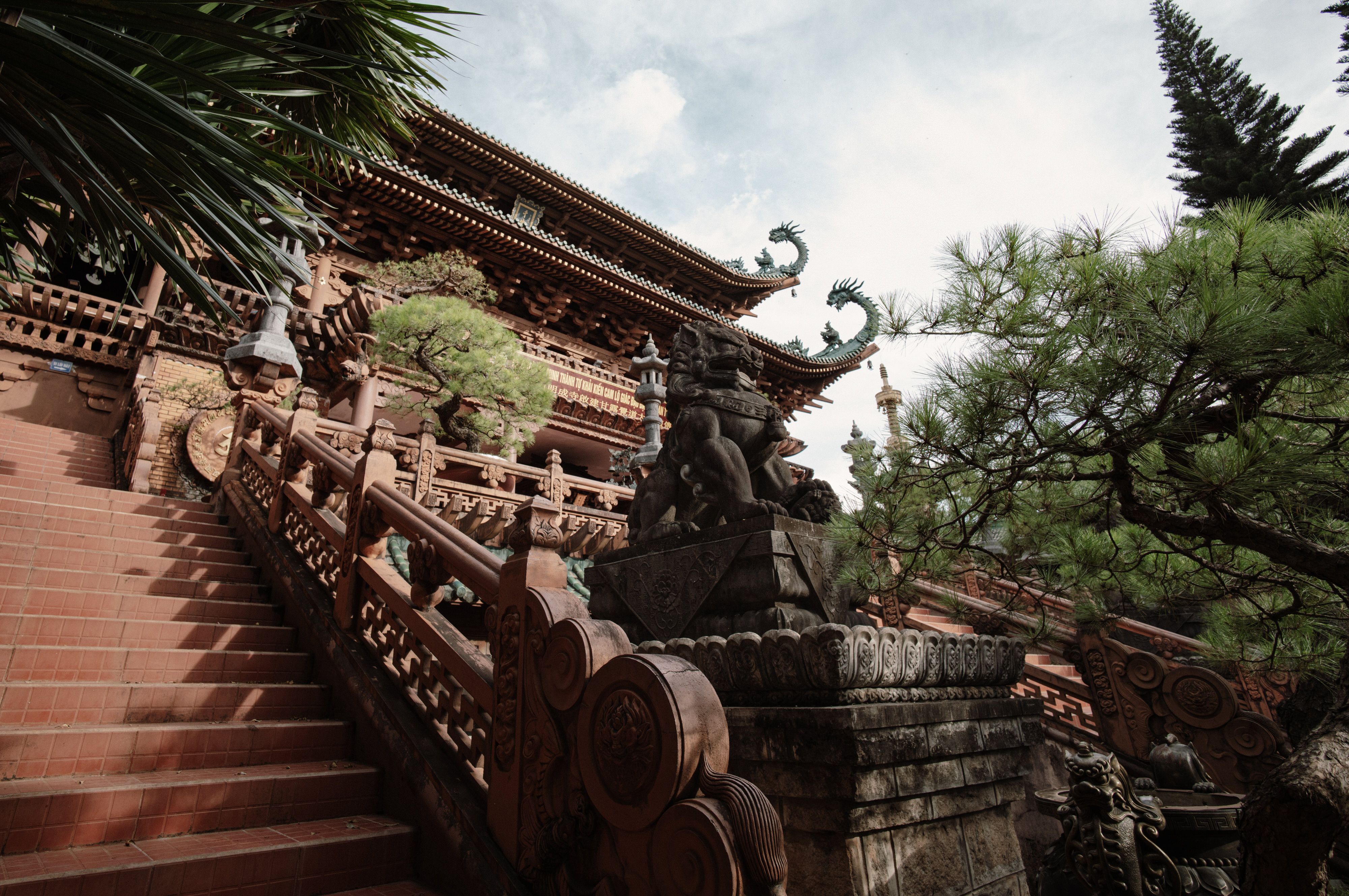 A staircase leading up to a temple with statues · Free Stock Photo