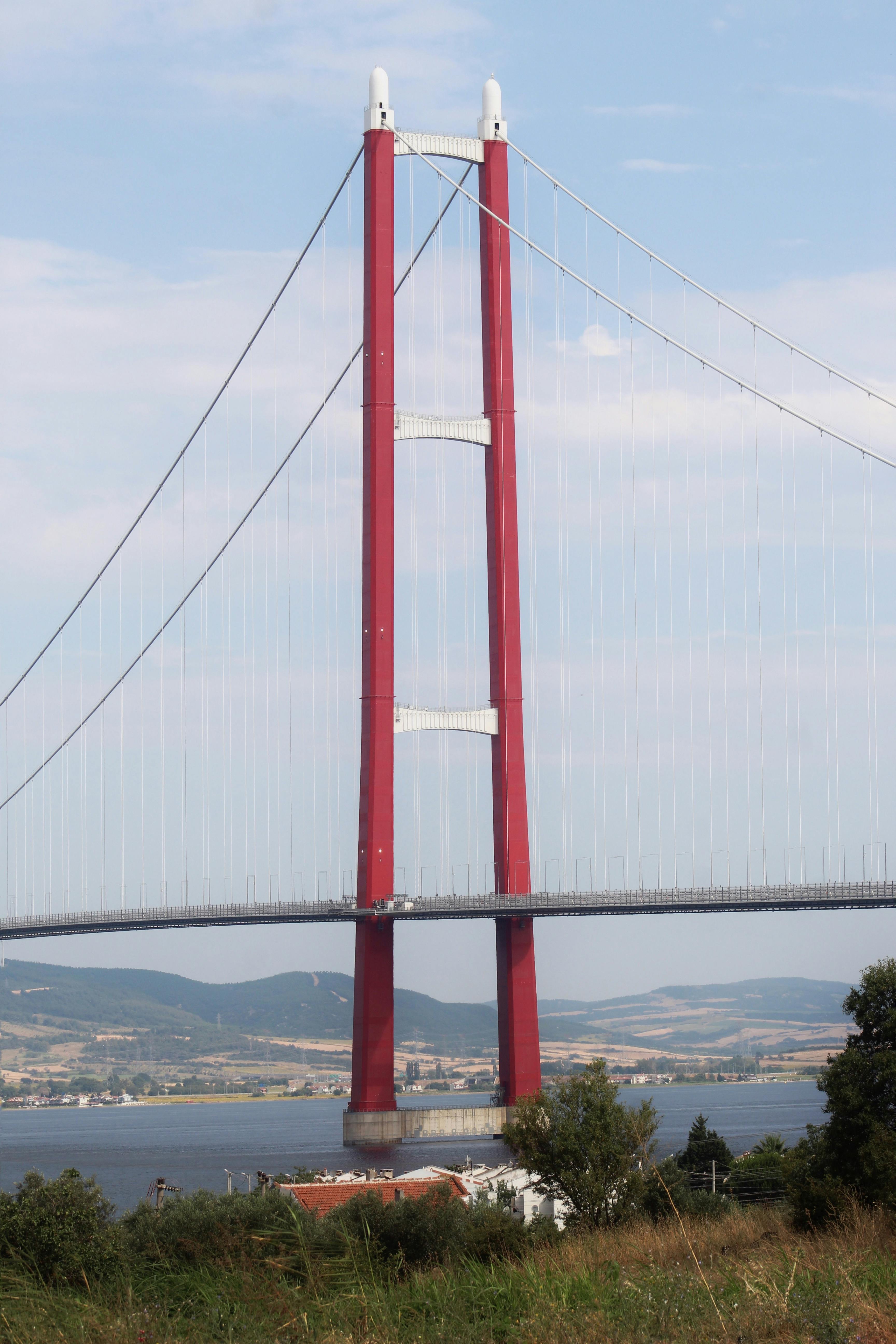 A large red bridge with a red and white bridge · Free Stock Photo