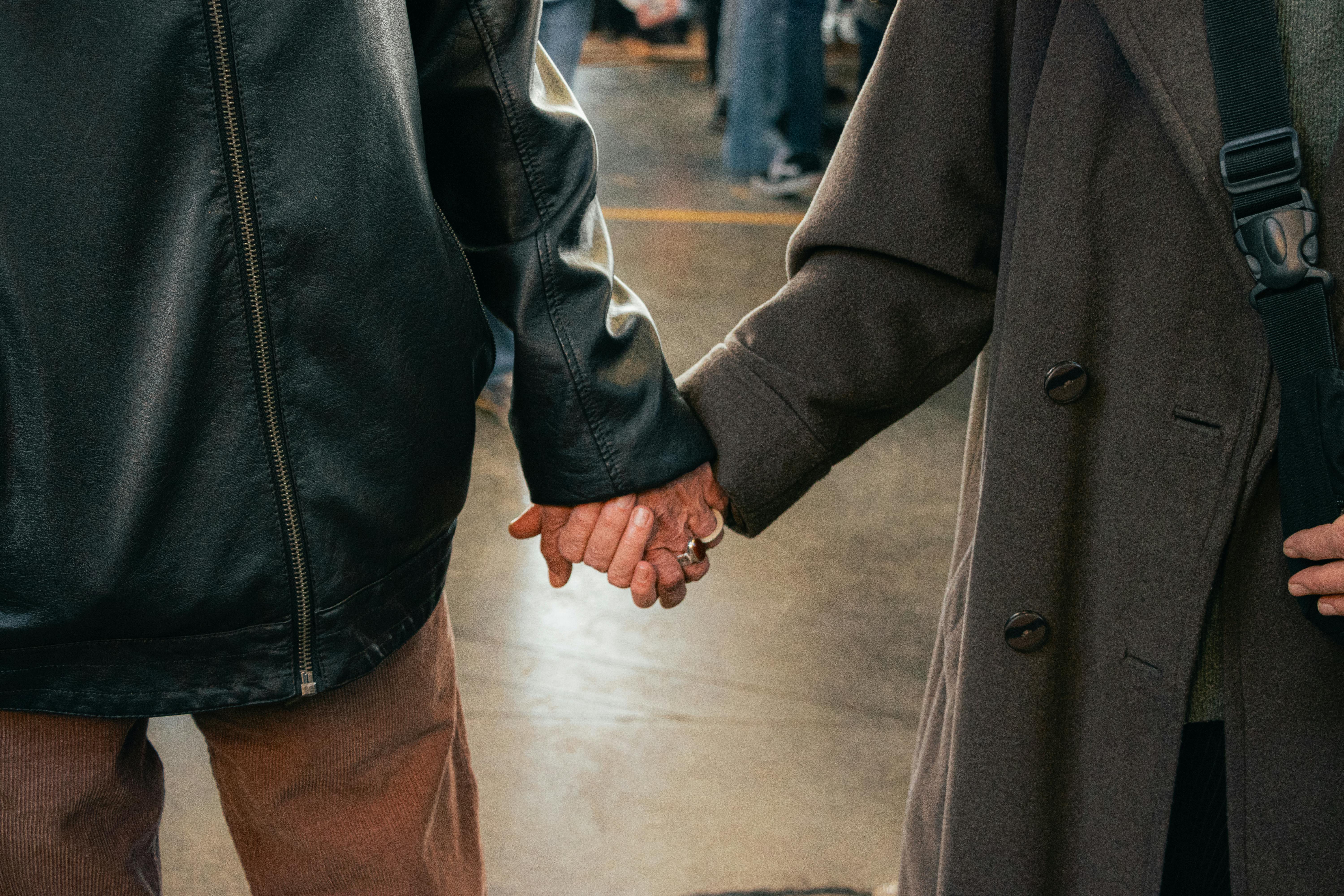 close-Up Photo of Two Person's Holding Hands · Free Stock Photo