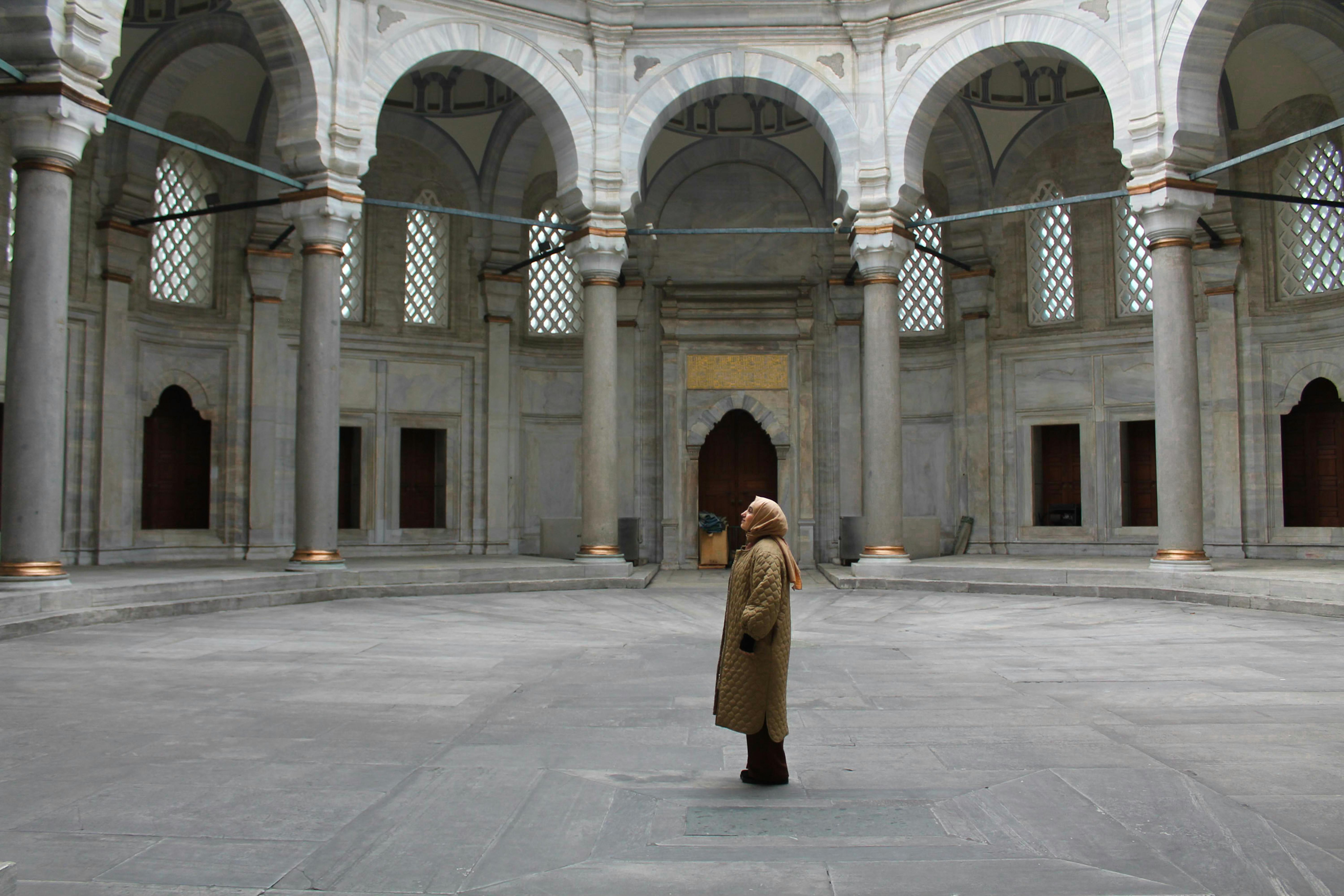 Man Standing Under Arch · Free Stock Photo