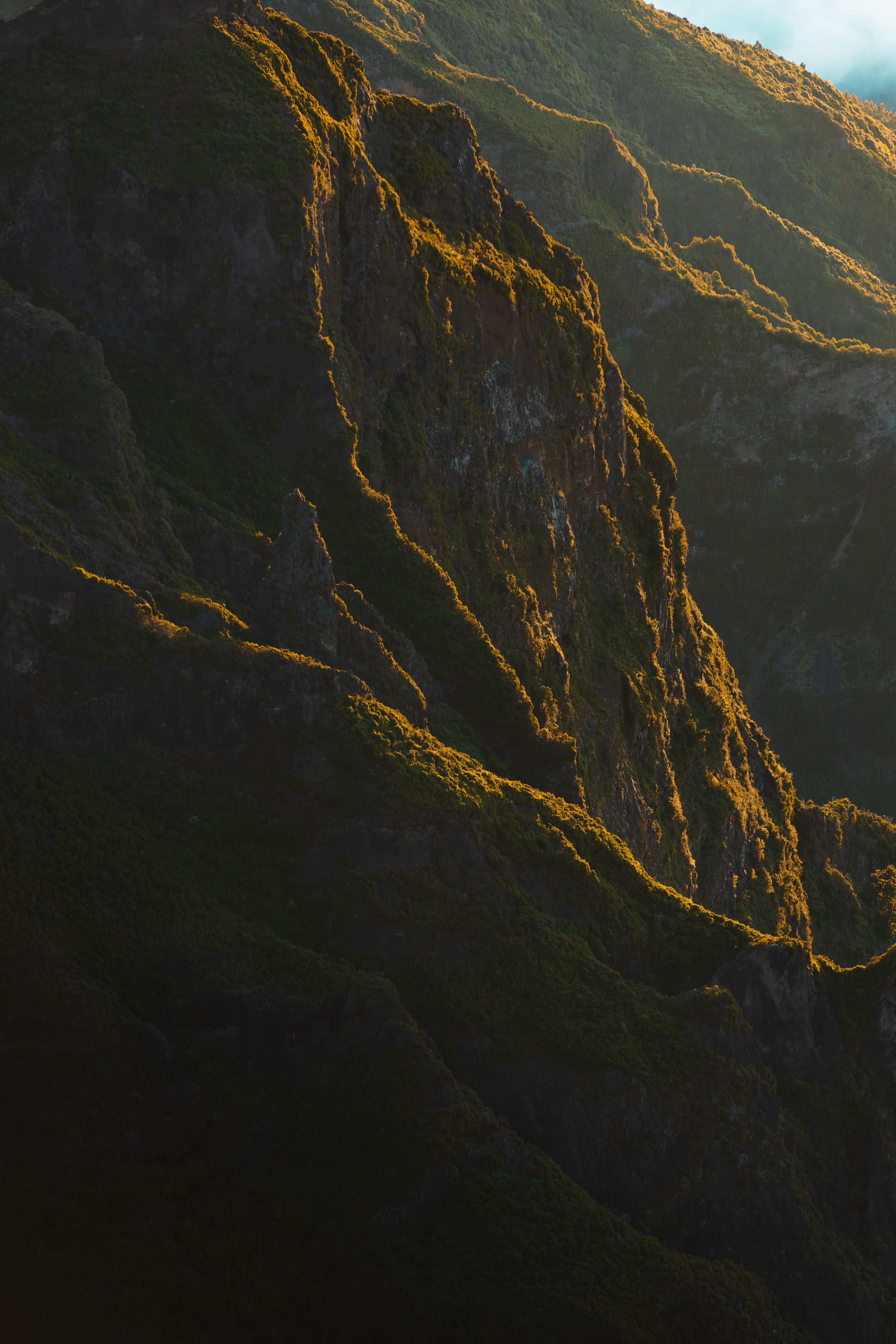 A mountain with a green grassy area · Free Stock Photo