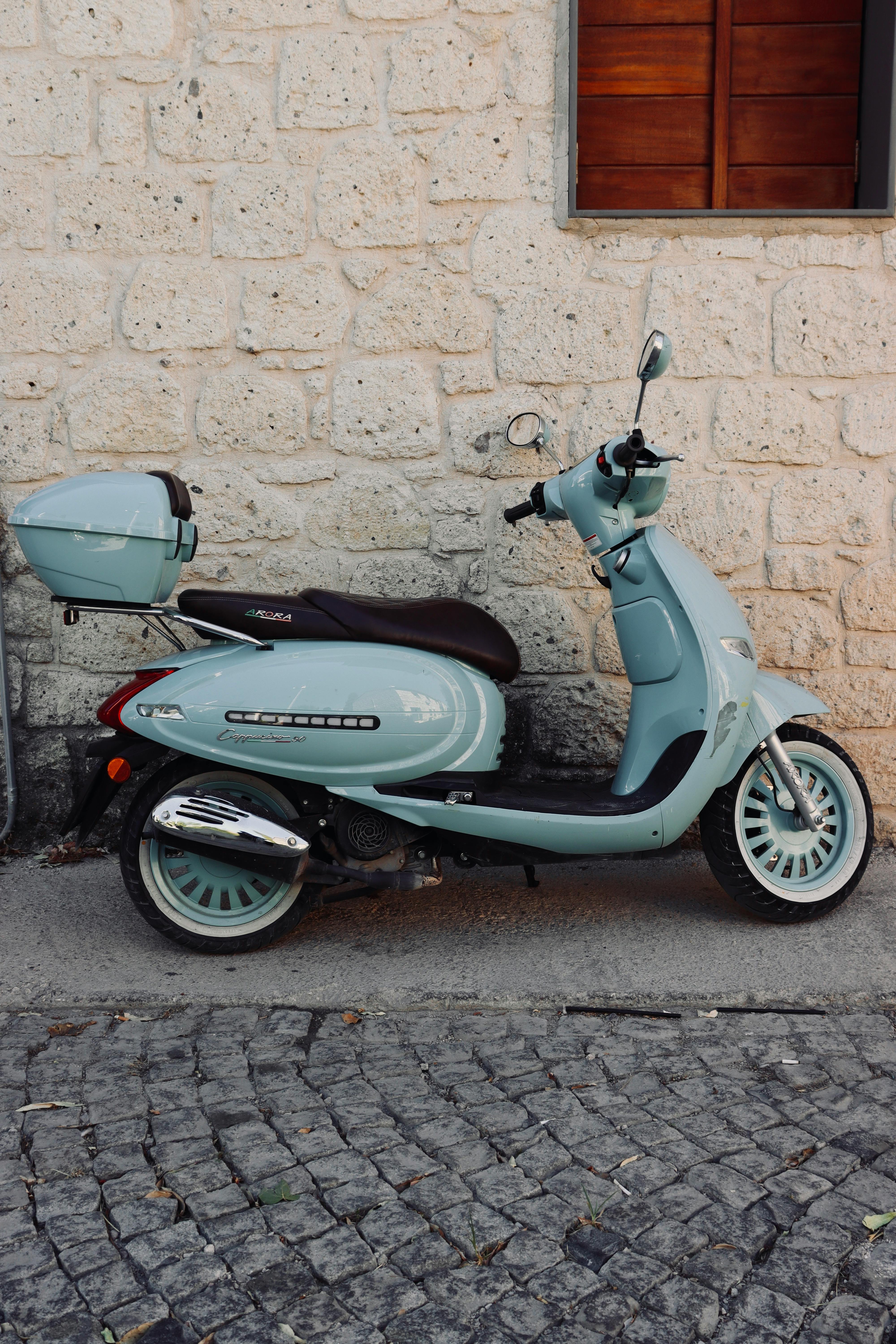 White and Blue Scooter Motorcycles · Free Stock Photo