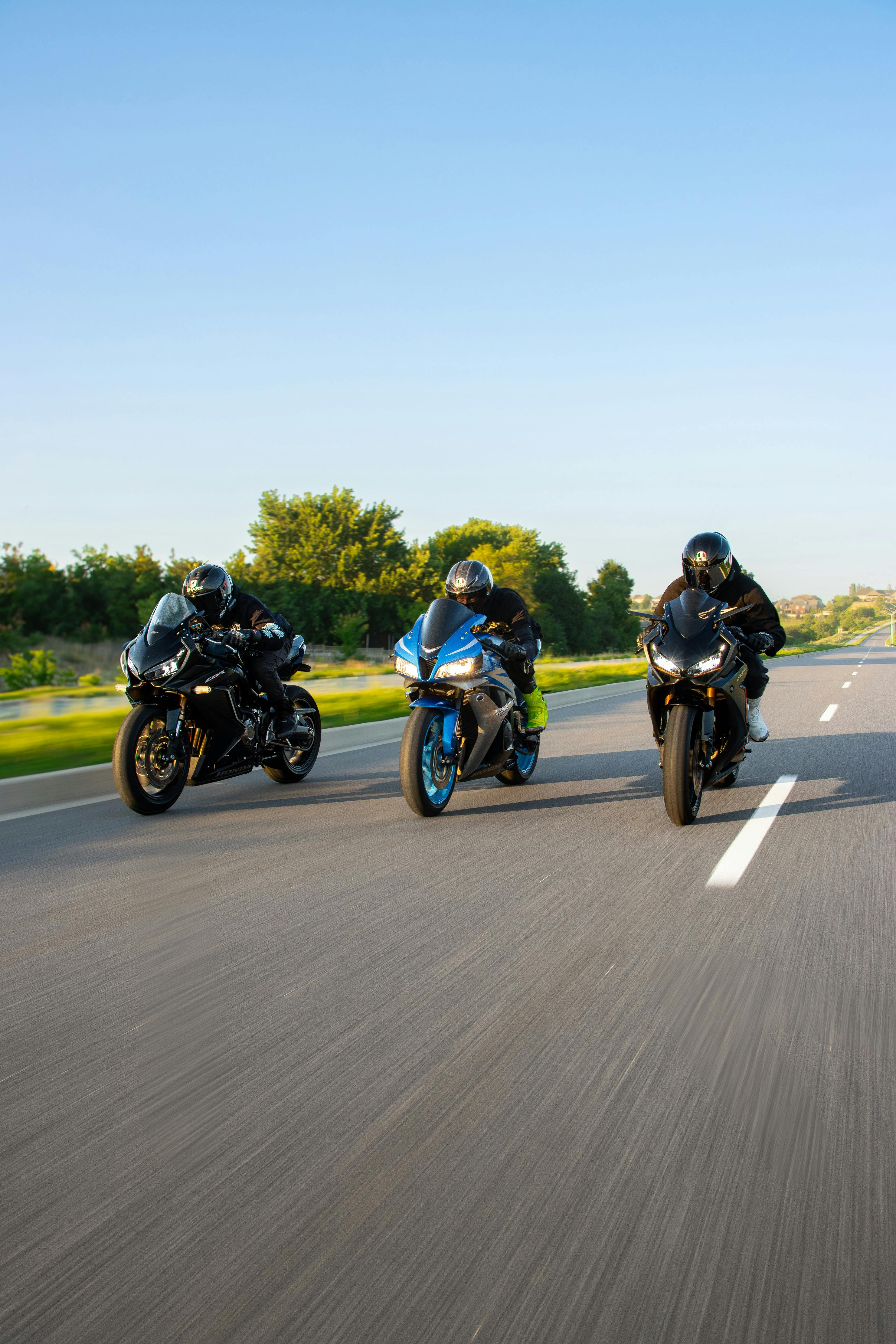 Black Backbone Motorcycle Near Man in Blue Shirt at Daytime · Free ...