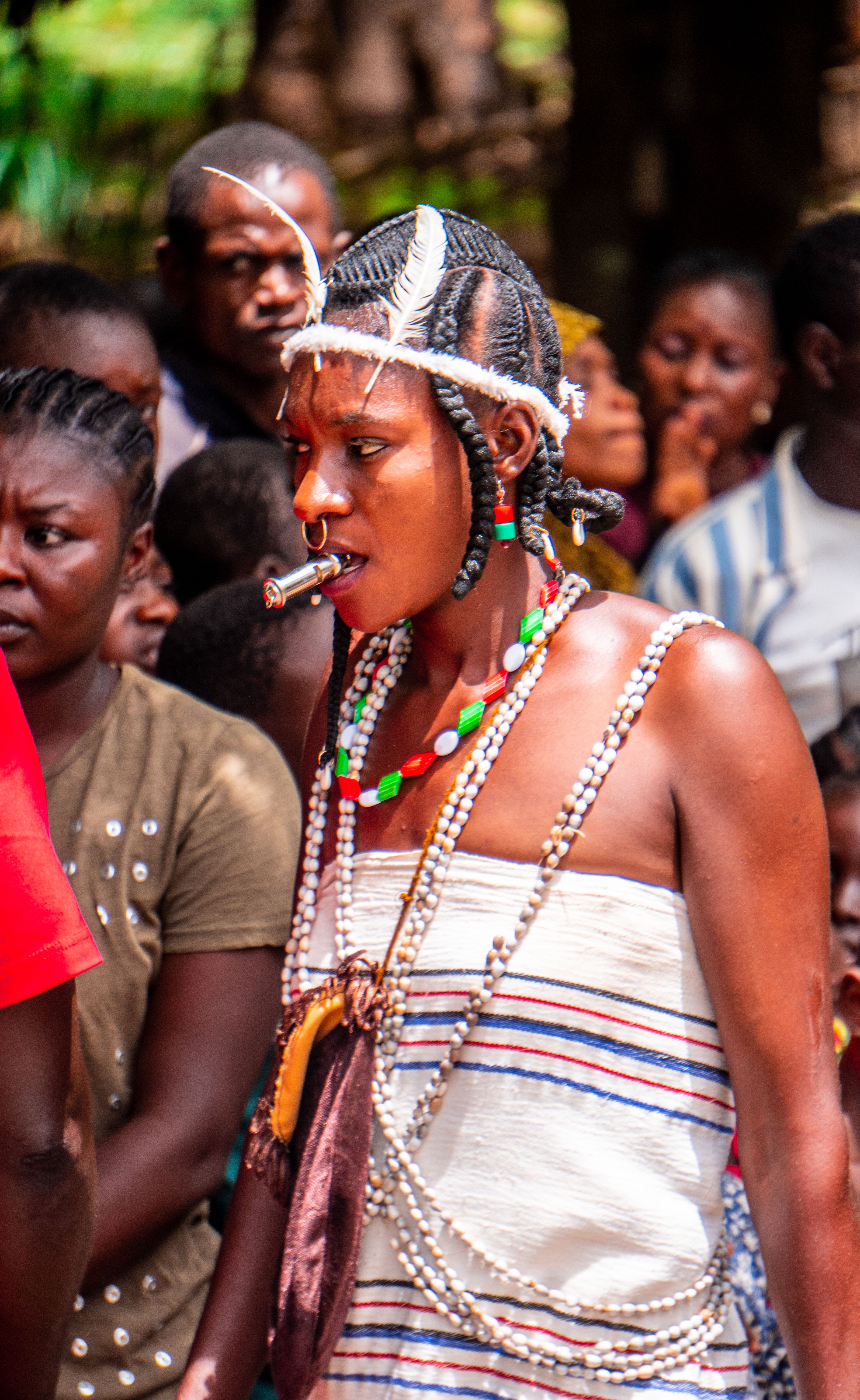 A woman in a traditional costume smoking a cigarette · Free Stock Photo