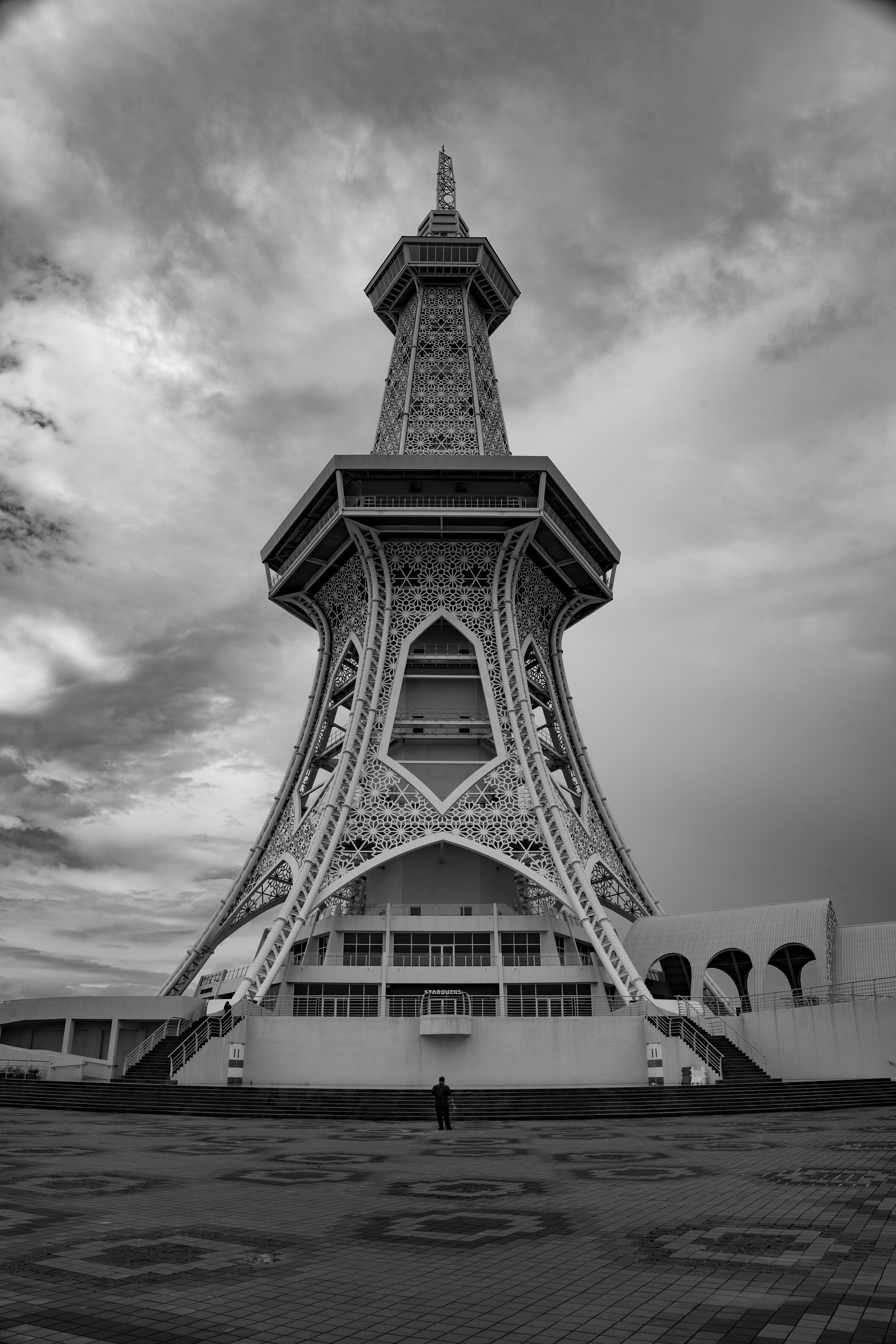 Man in front of the Maha Tower in Langkawi · Free Stock Photo