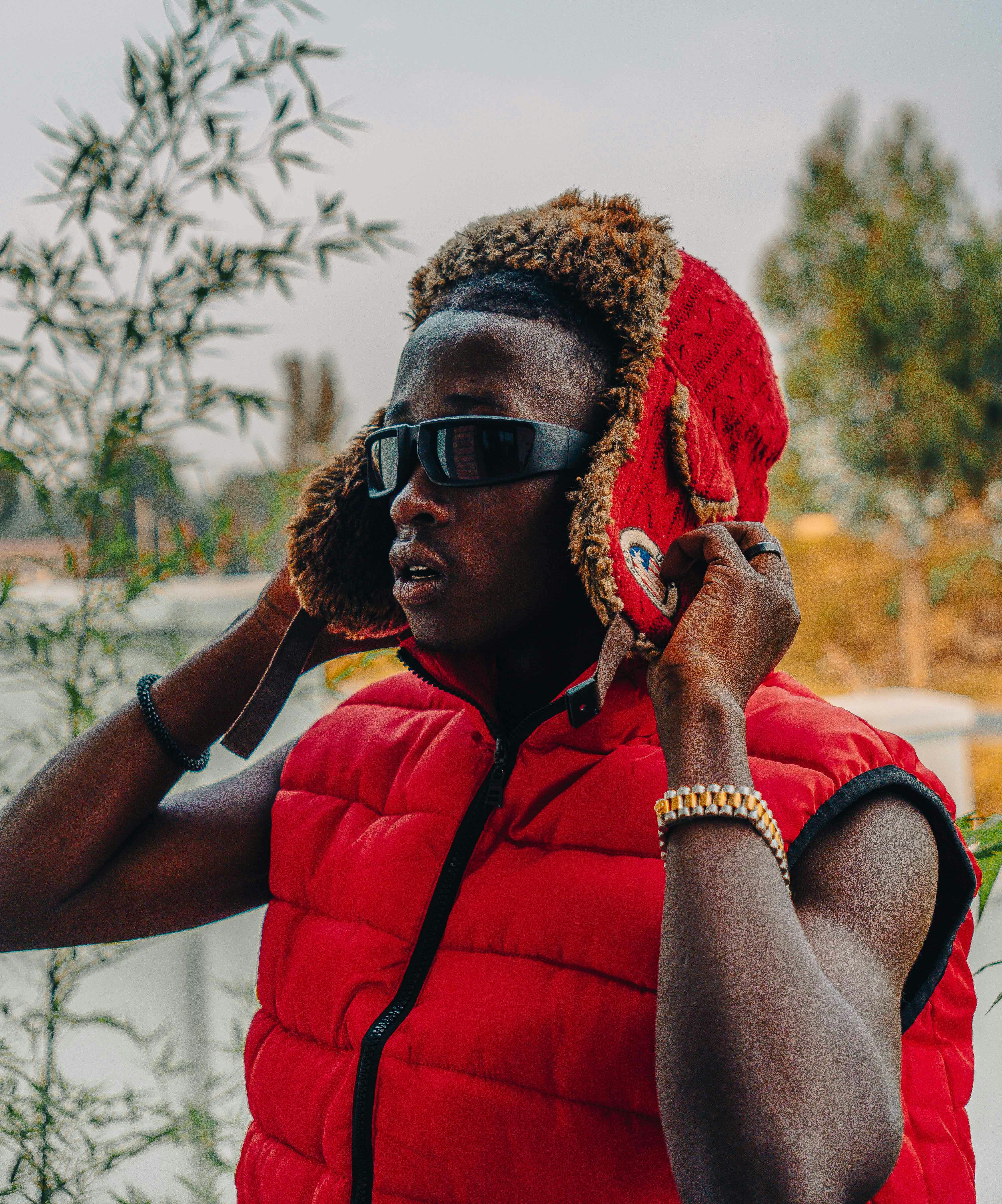 A man in a red vest and sunglasses · Free Stock Photo