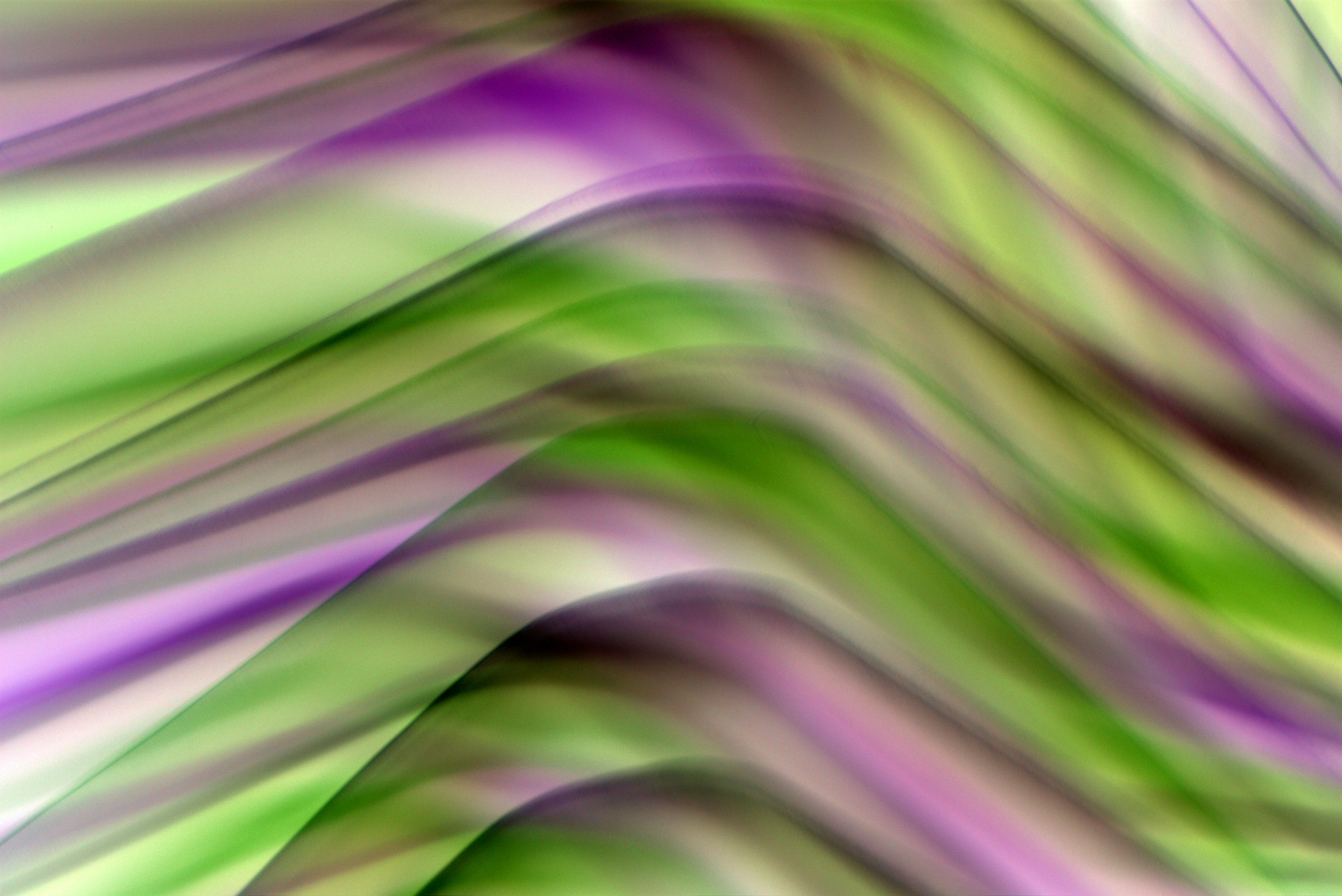 A purple and green abstract background with waves · Free Stock Photo