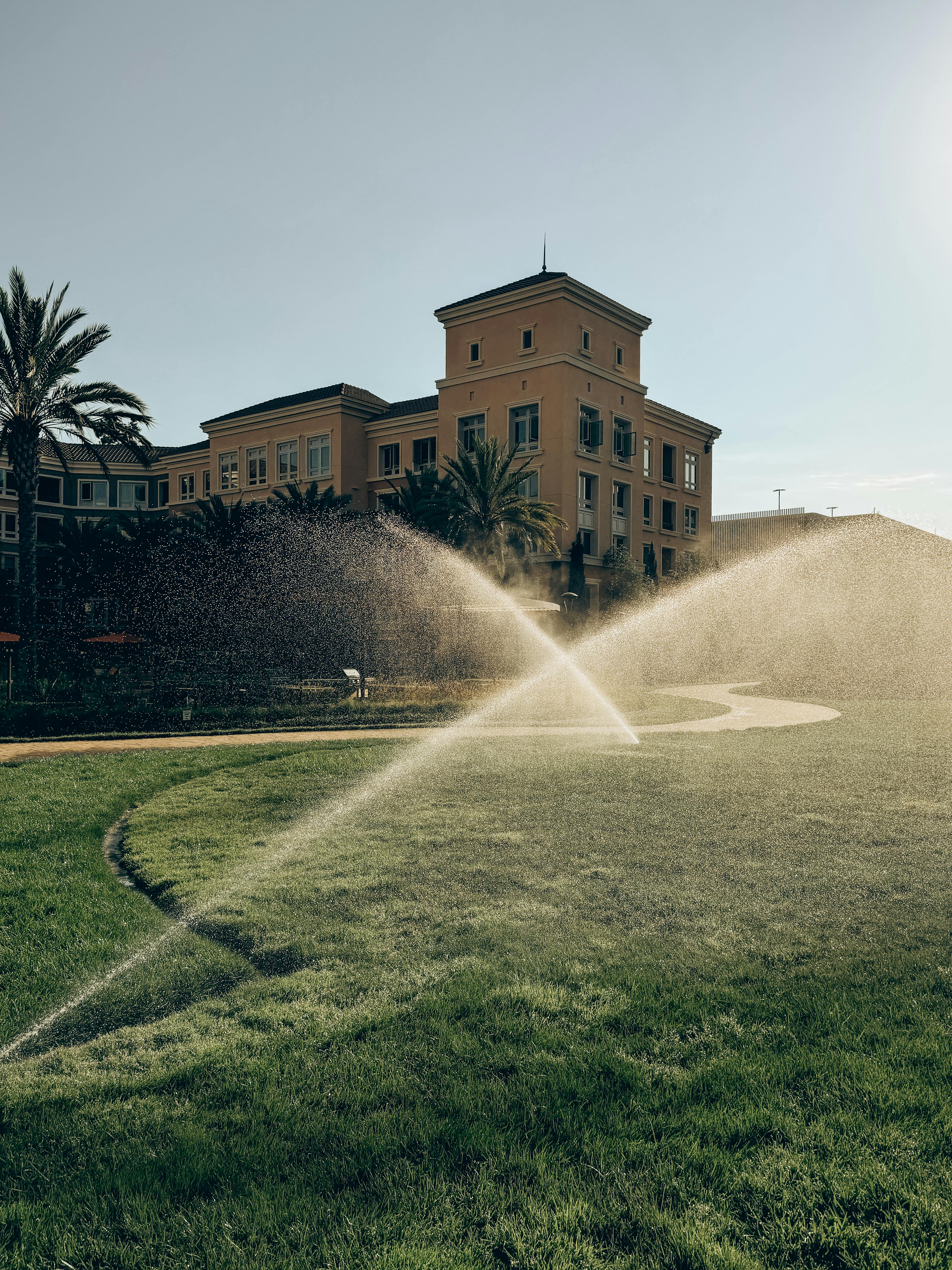 Sprinklers Watering Lawn at Palace · Free Stock Photo