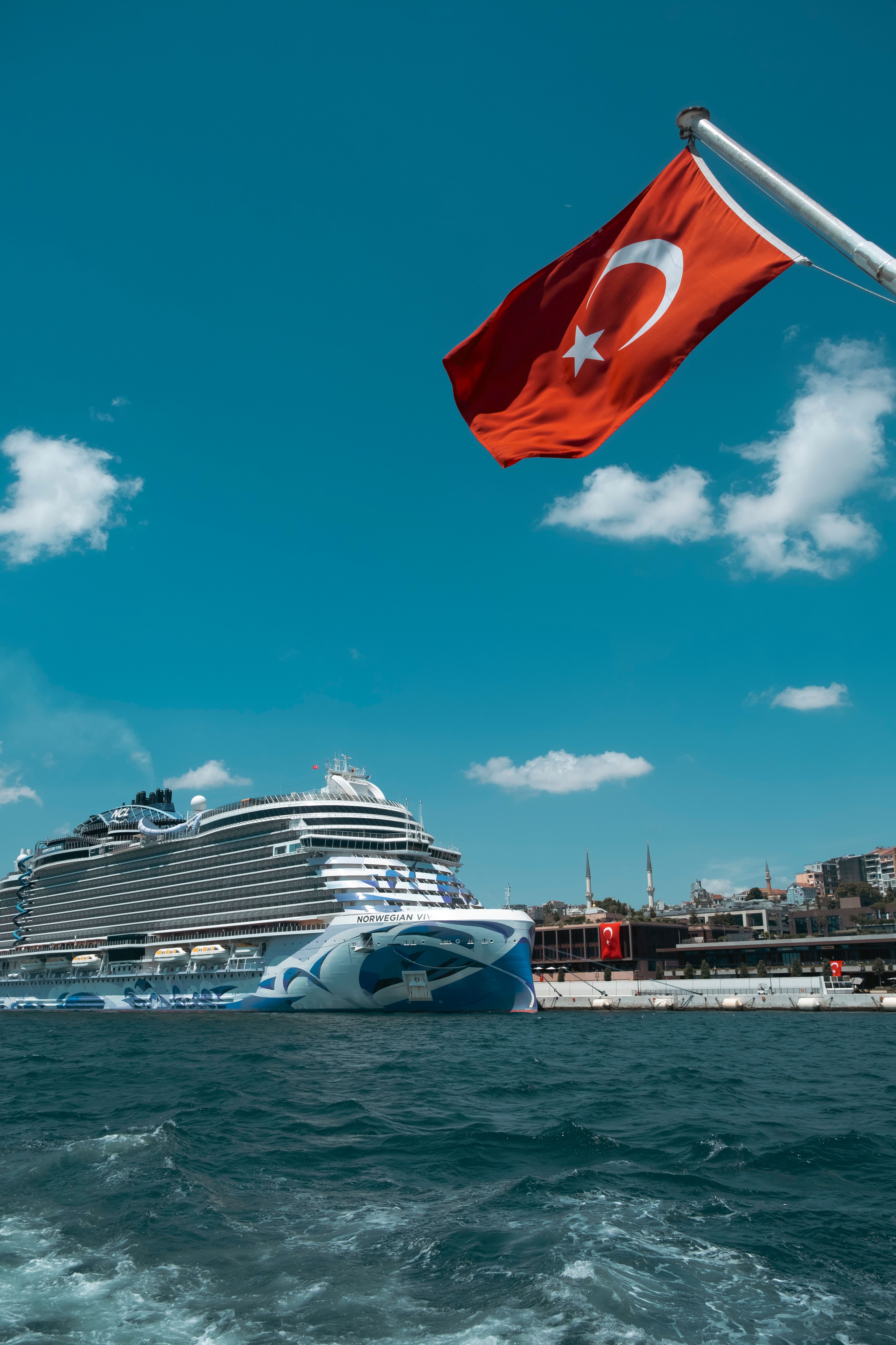 A cruise ship with a turkish flag in the water · Free Stock Photo