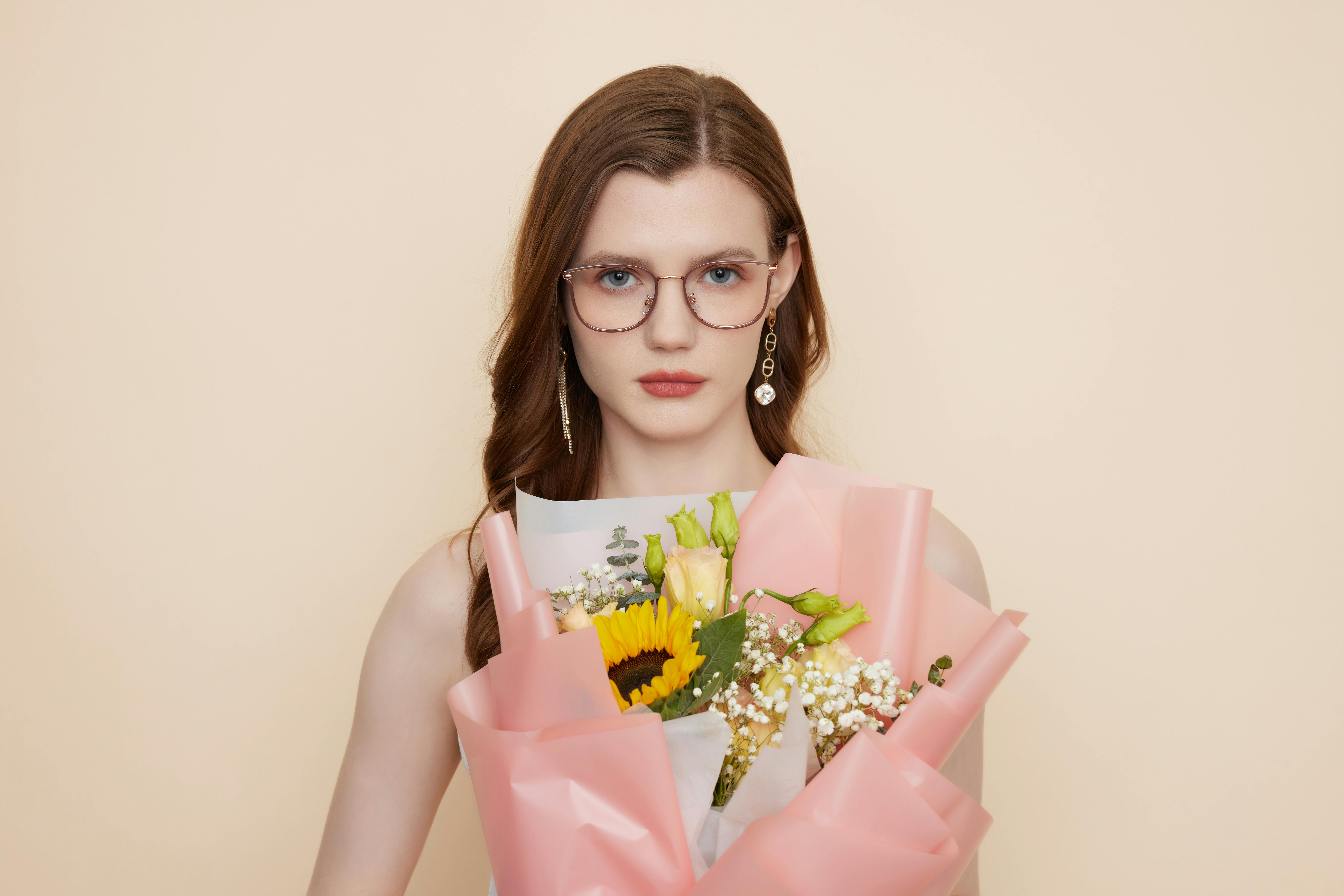 Graceful Elegance: Sophisticated Eyewear and Floral Beauty · Free Stock ...