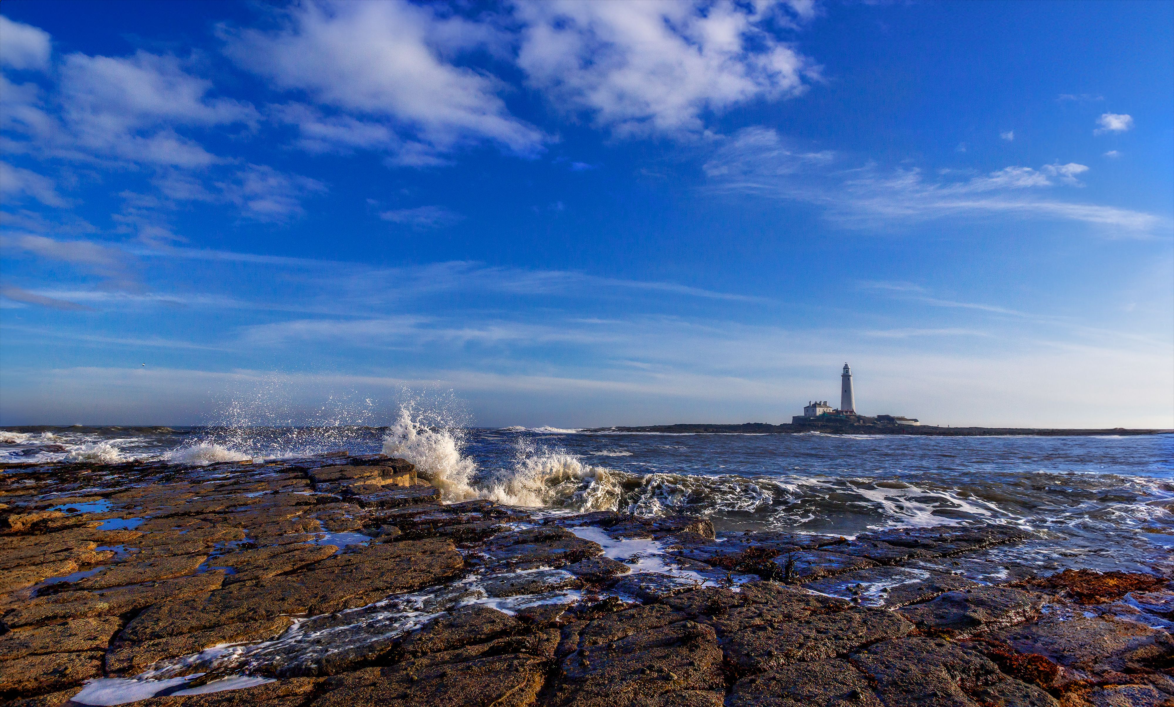 Light House Near Rock Formation Body of Water · Free Stock Photo