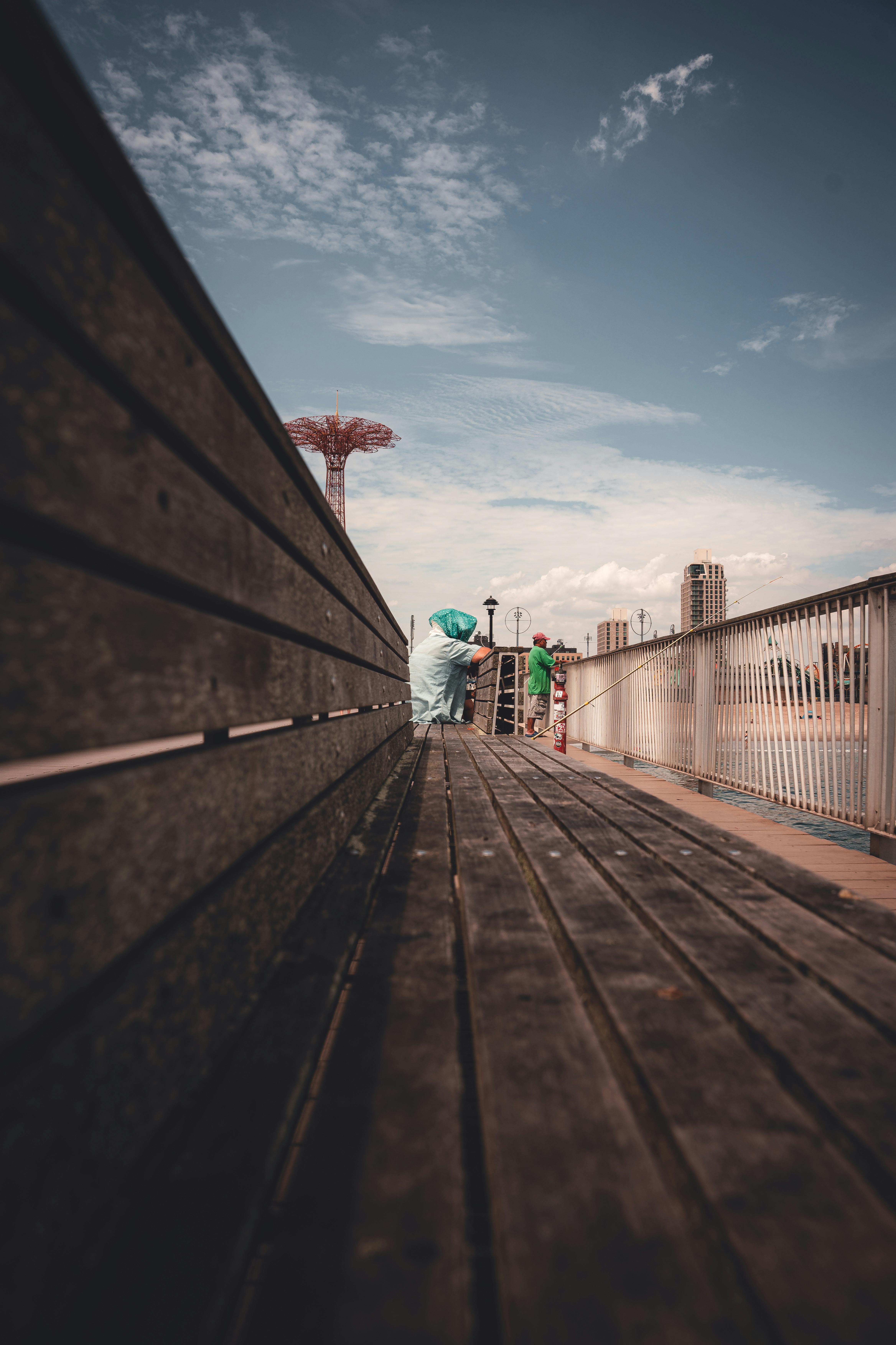 A wooden bench with a view of the sky · Free Stock Photo