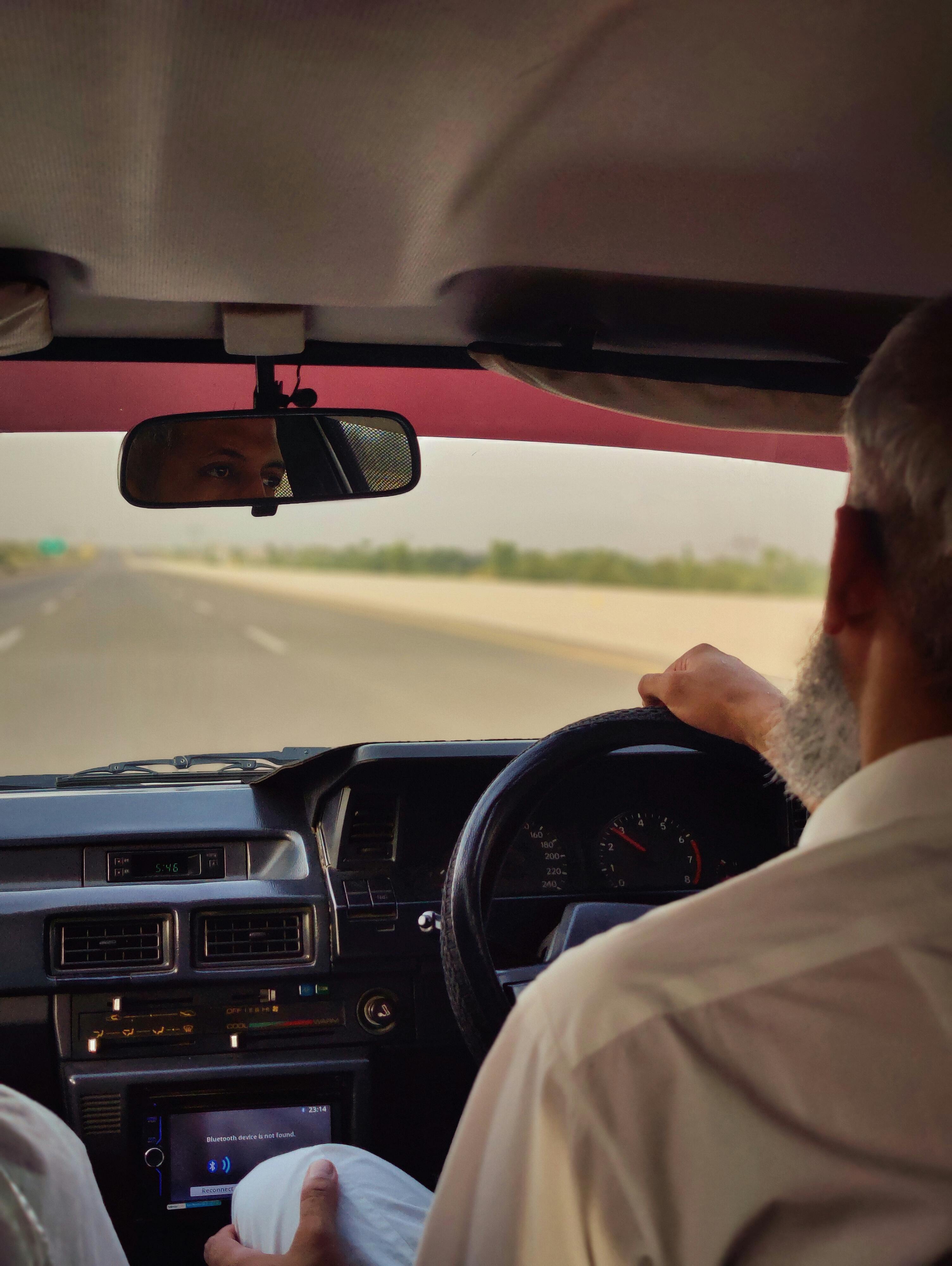 Photo of Man Driving a Convertible Vehicle · Free Stock Photo