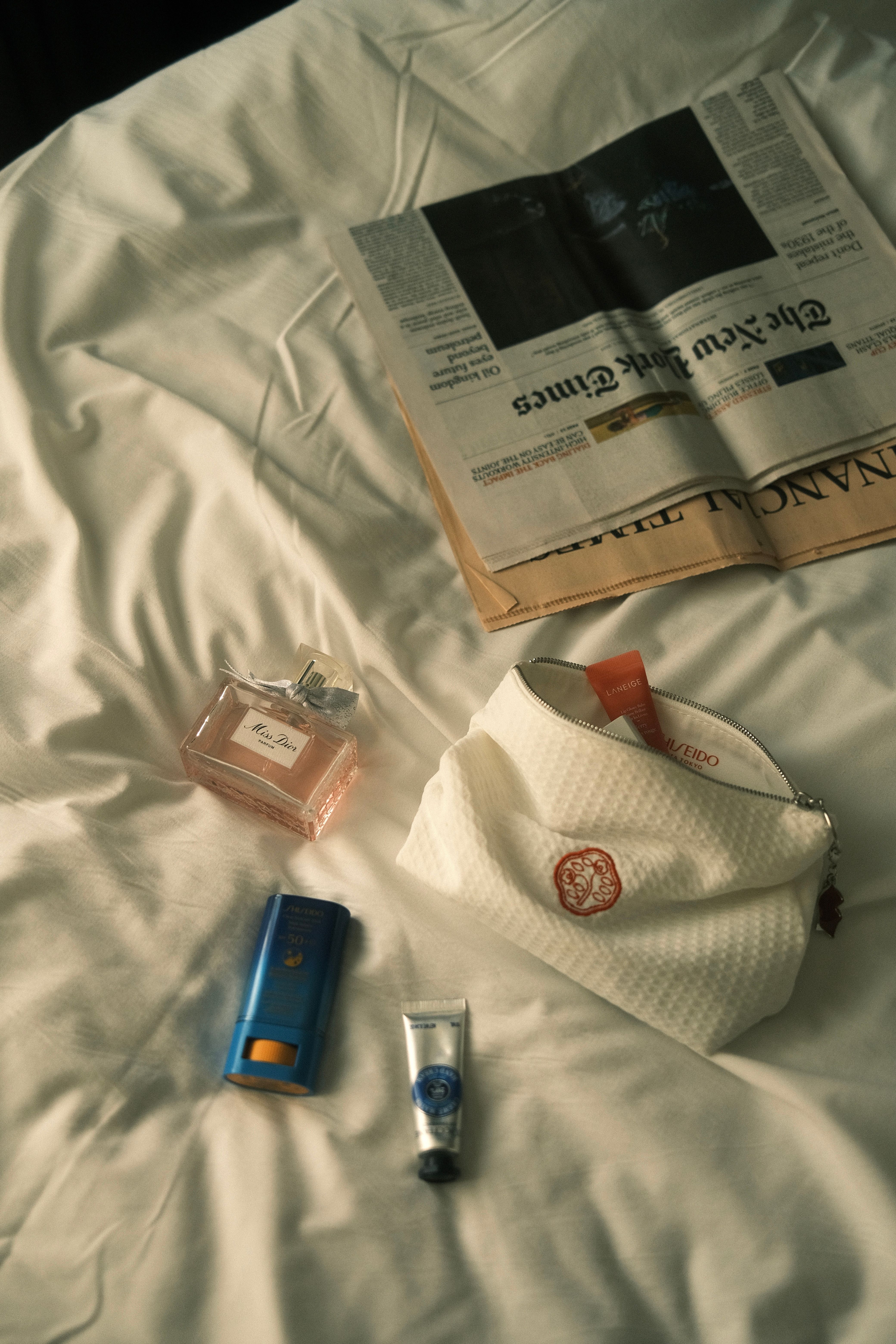Cosmetics on Bed · Free Stock Photo