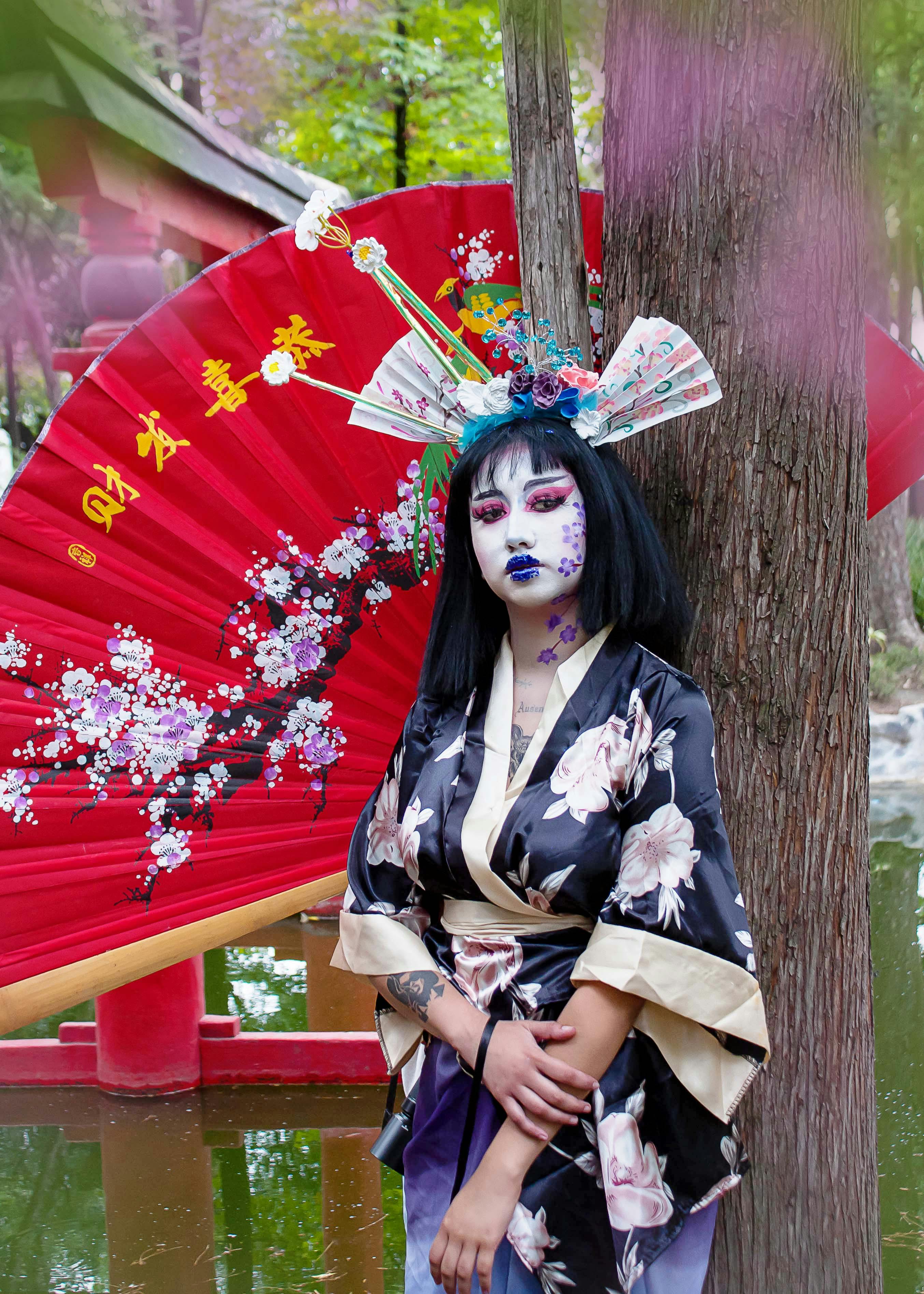 Woman Holding White and Brown Hand Fan · Free Stock Photo