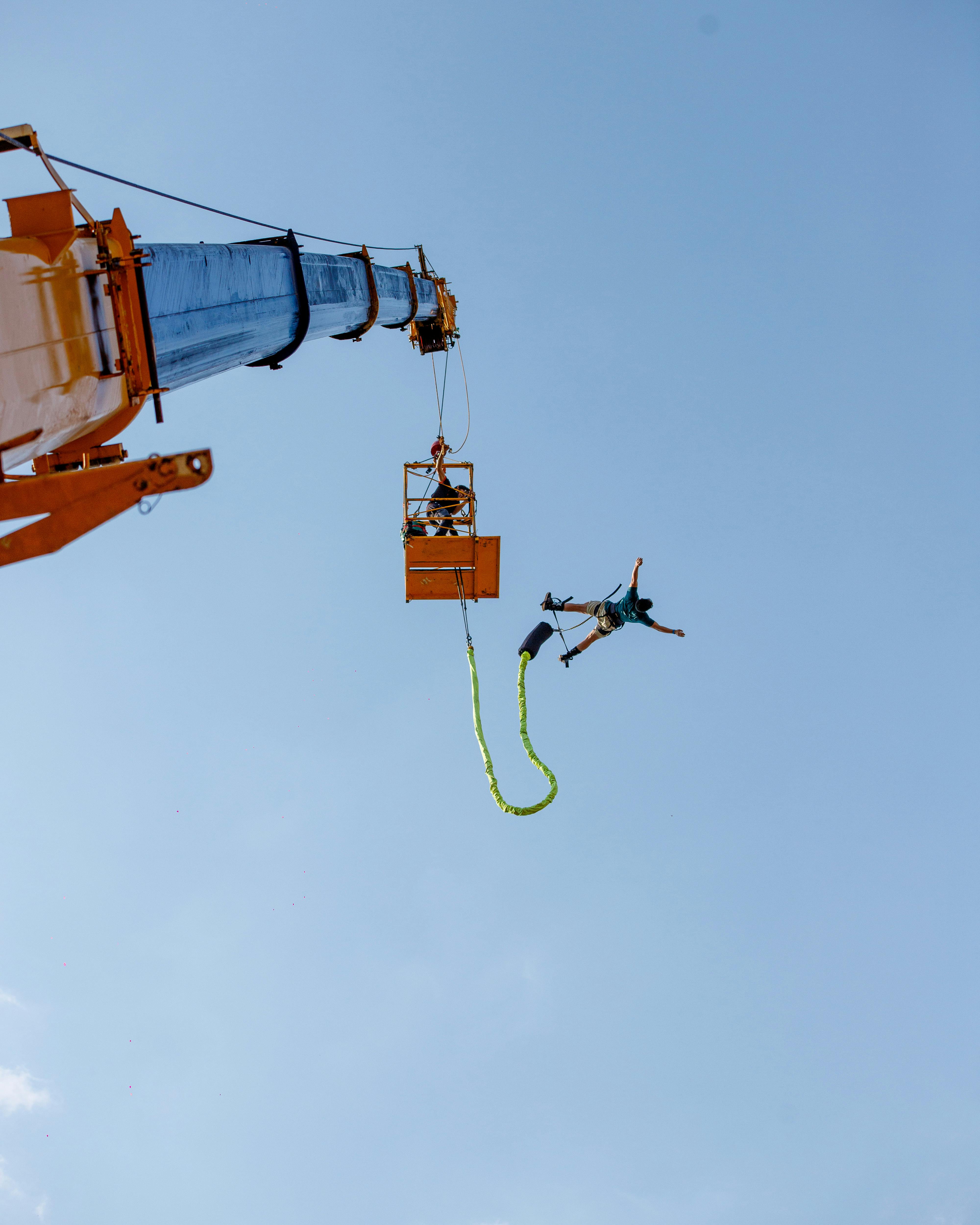 Low Angle Shot of Man Bungee Jumping · Free Stock Photo