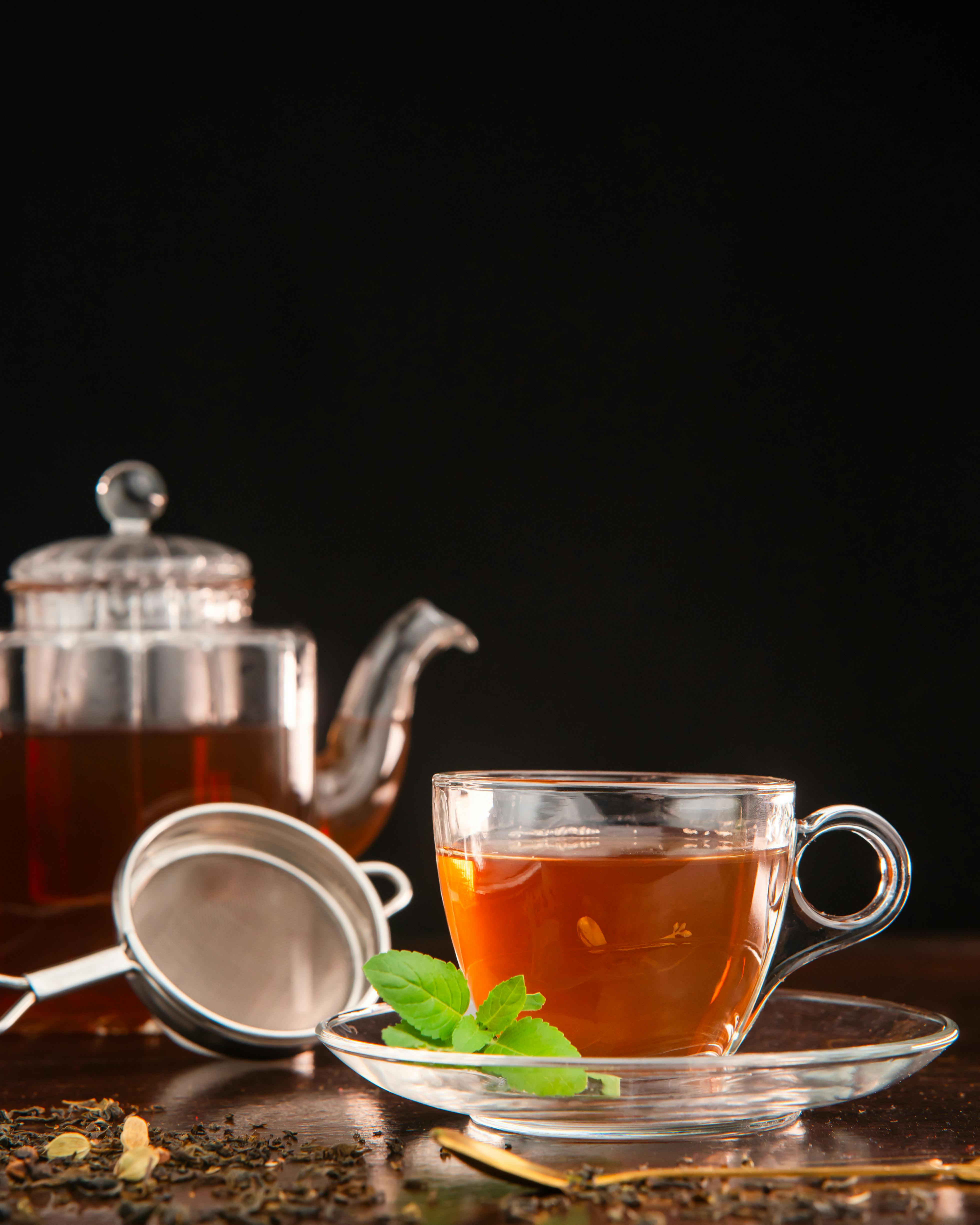 Clear Glass Cup on Brown Wooden Table · Free Stock Photo