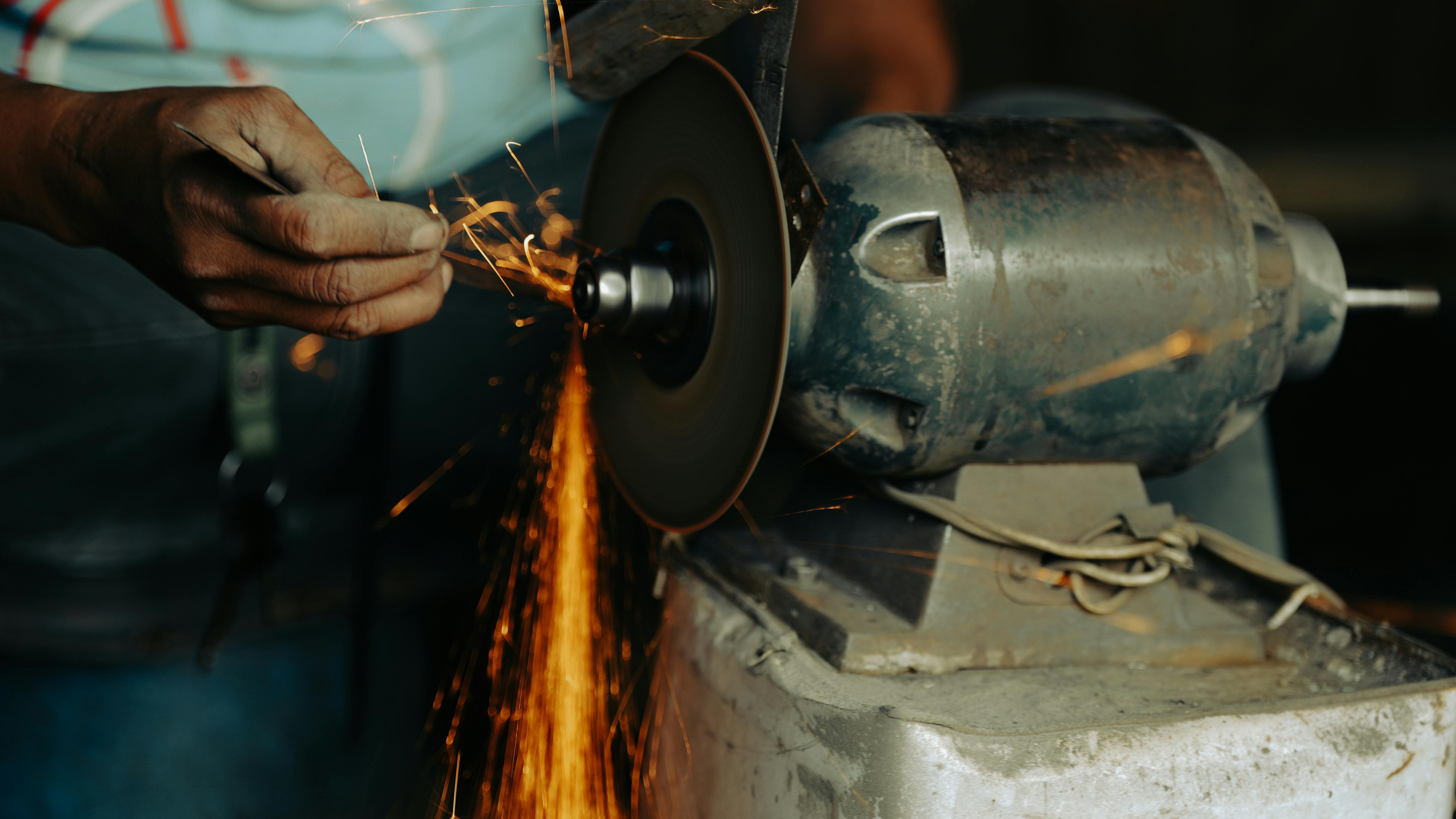 A Man Welding Metal · Free Stock Photo