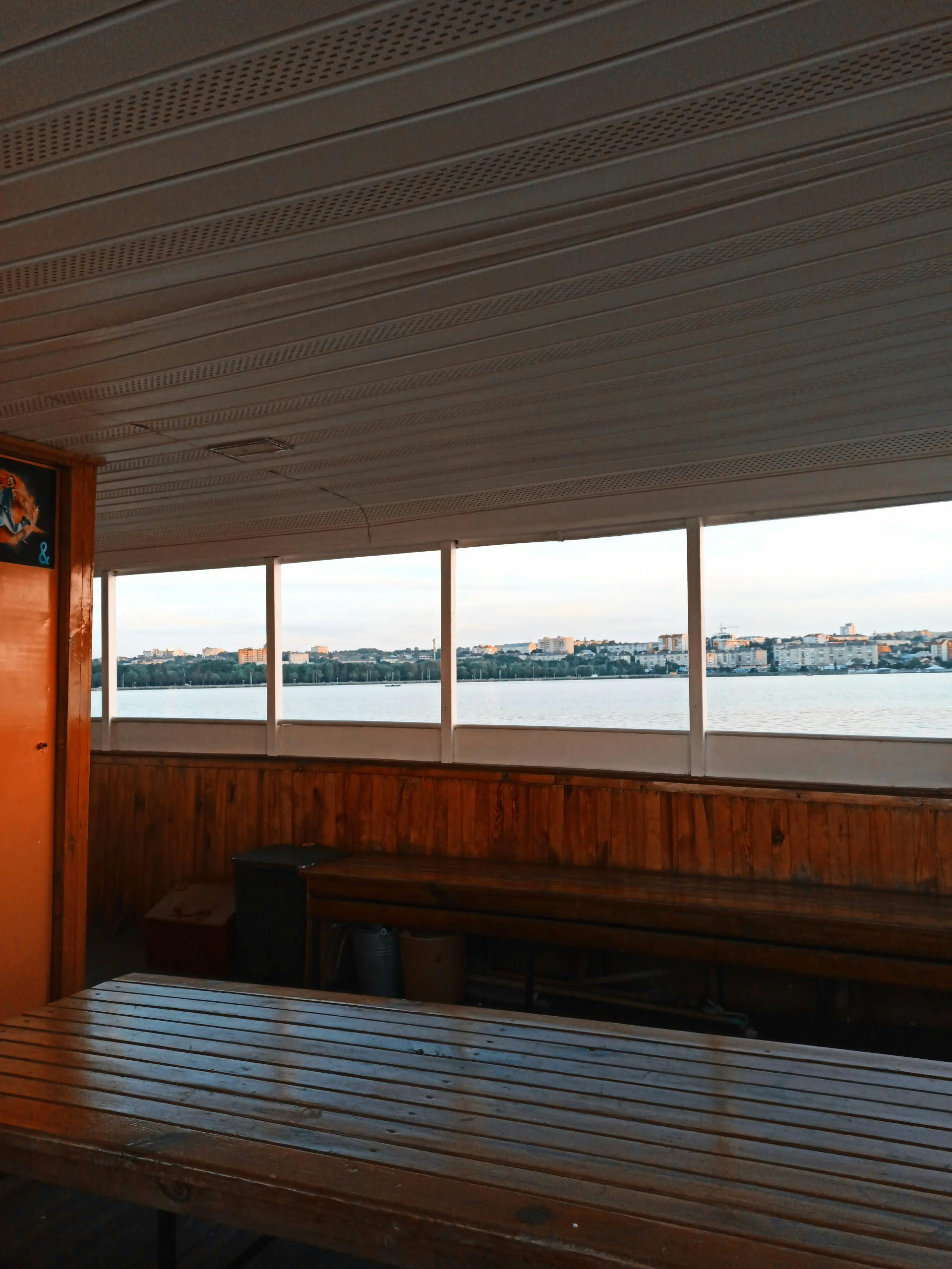 A view of a boat from a window on the side · Free Stock Photo