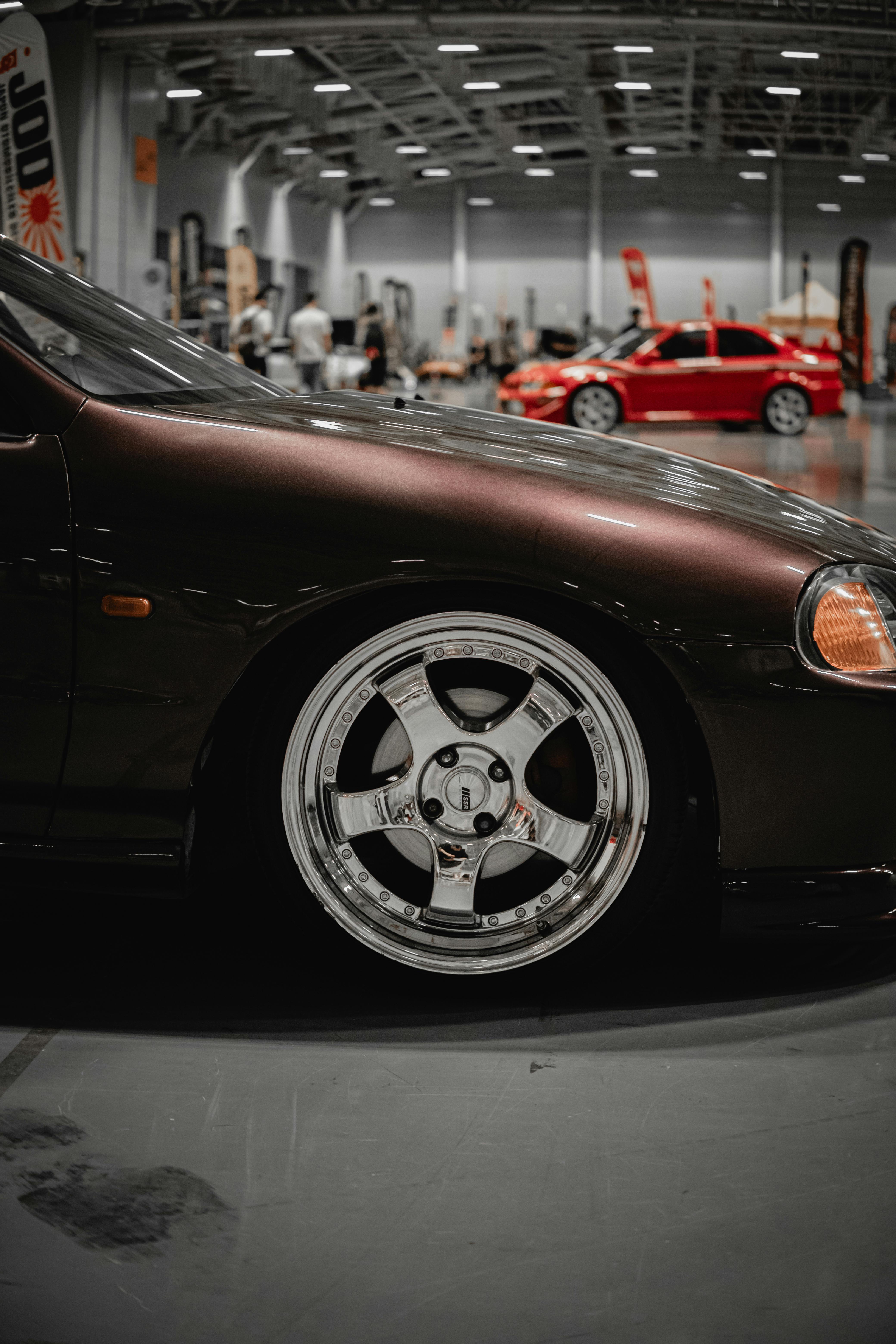 A car with rims in a garage · Free Stock Photo