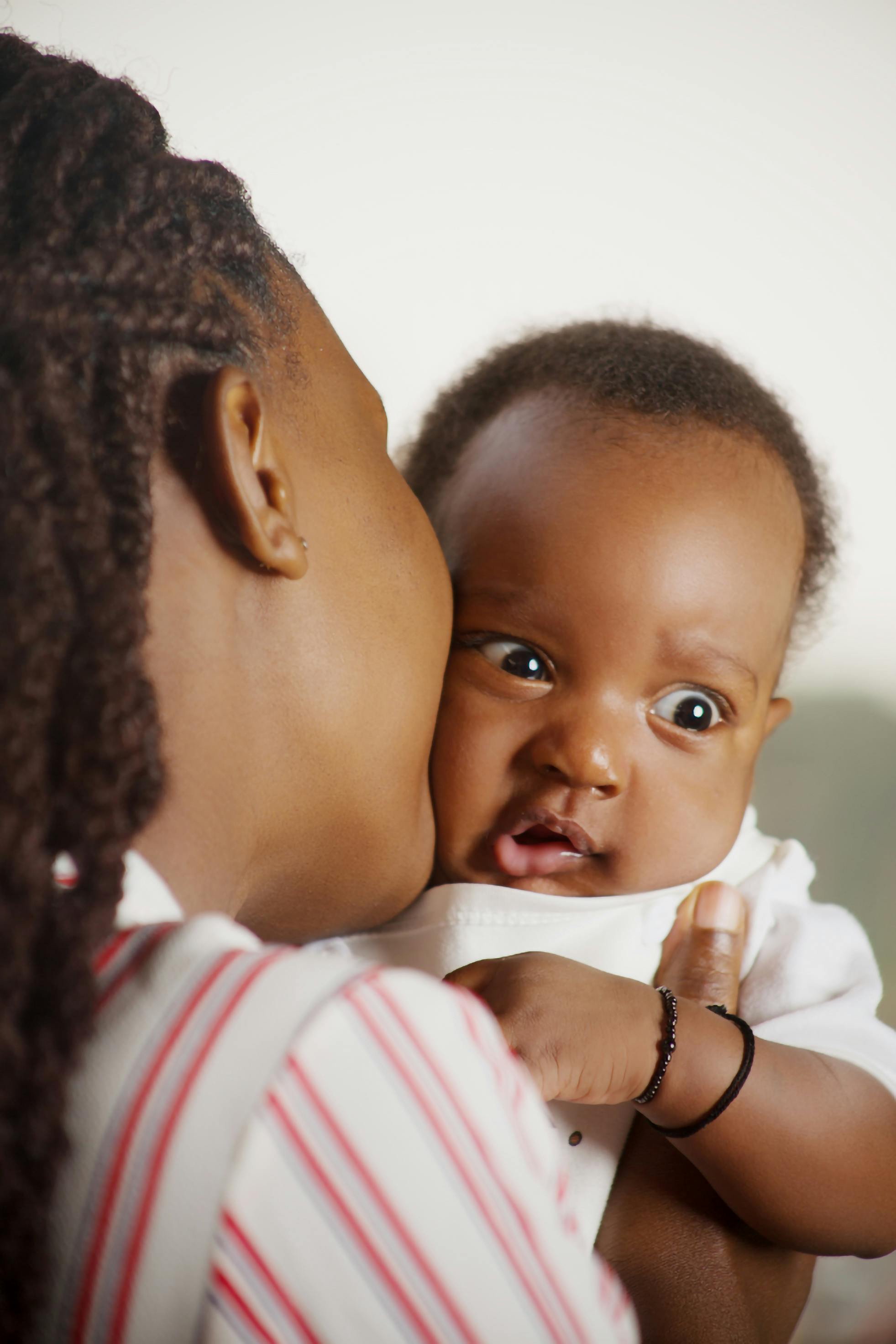 Woman Carrying Baby · Free Stock Photo