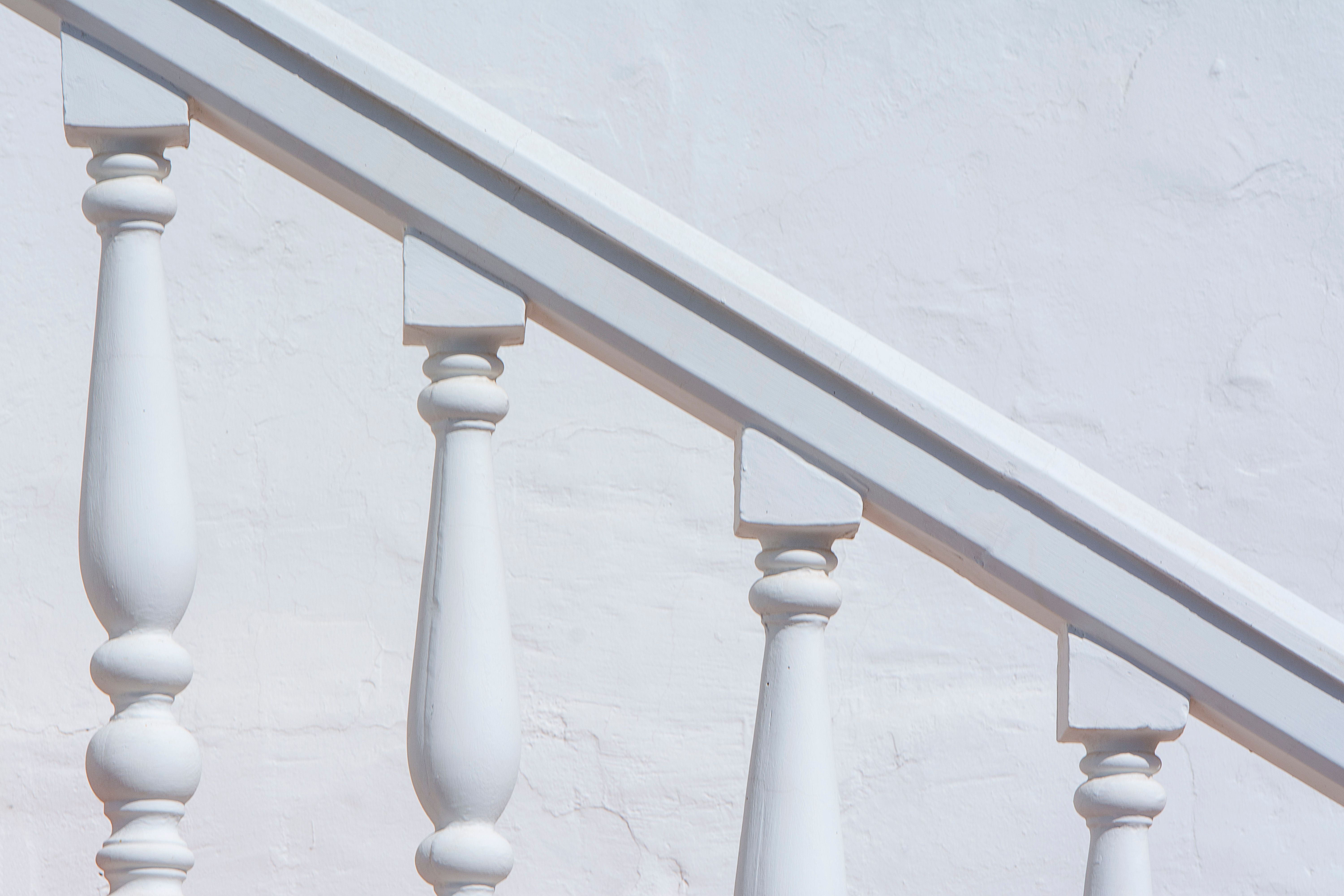 A close up of a white stair railing · Free Stock Photo