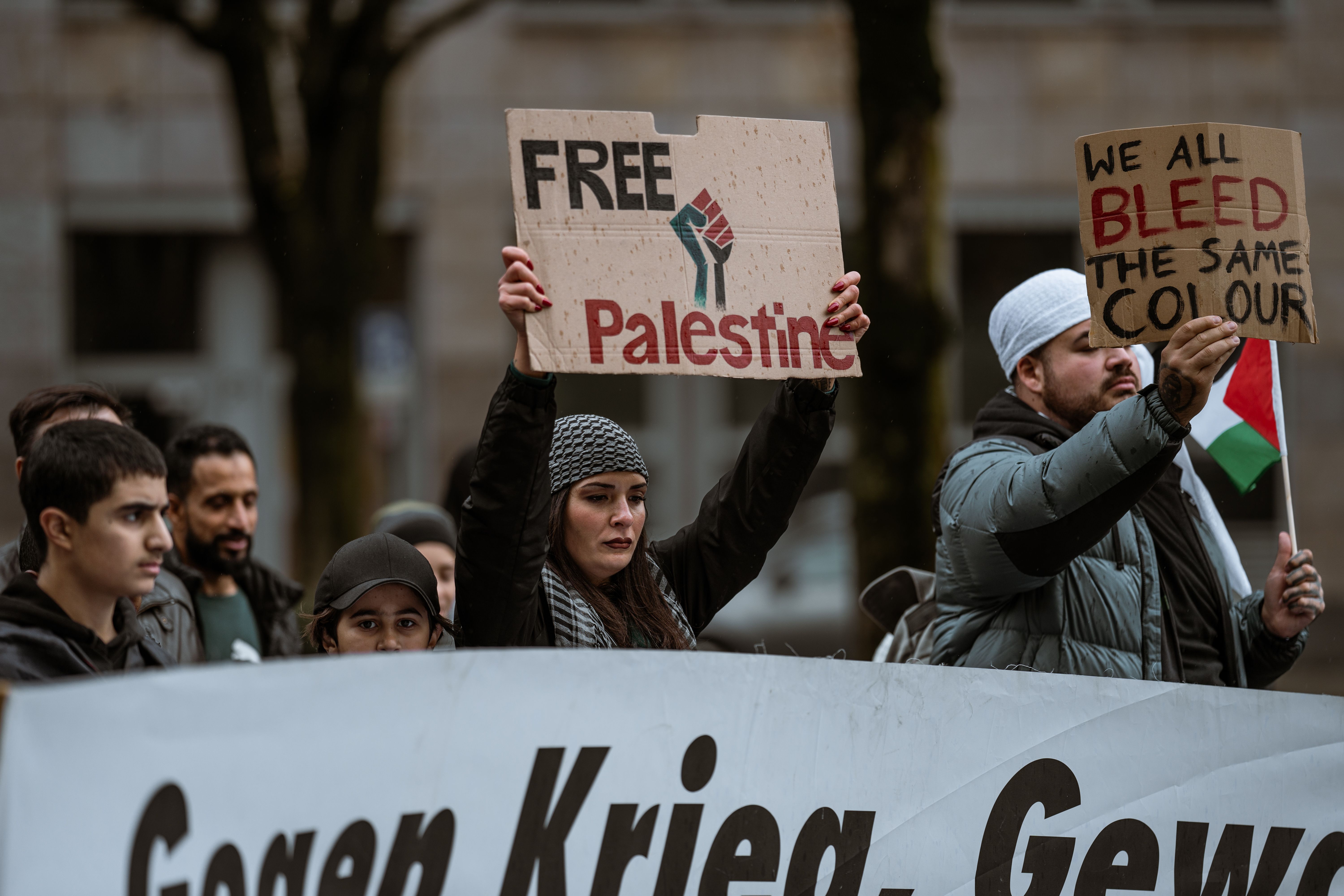 Protesters hold up signs that say free palestine · Free Stock Photo