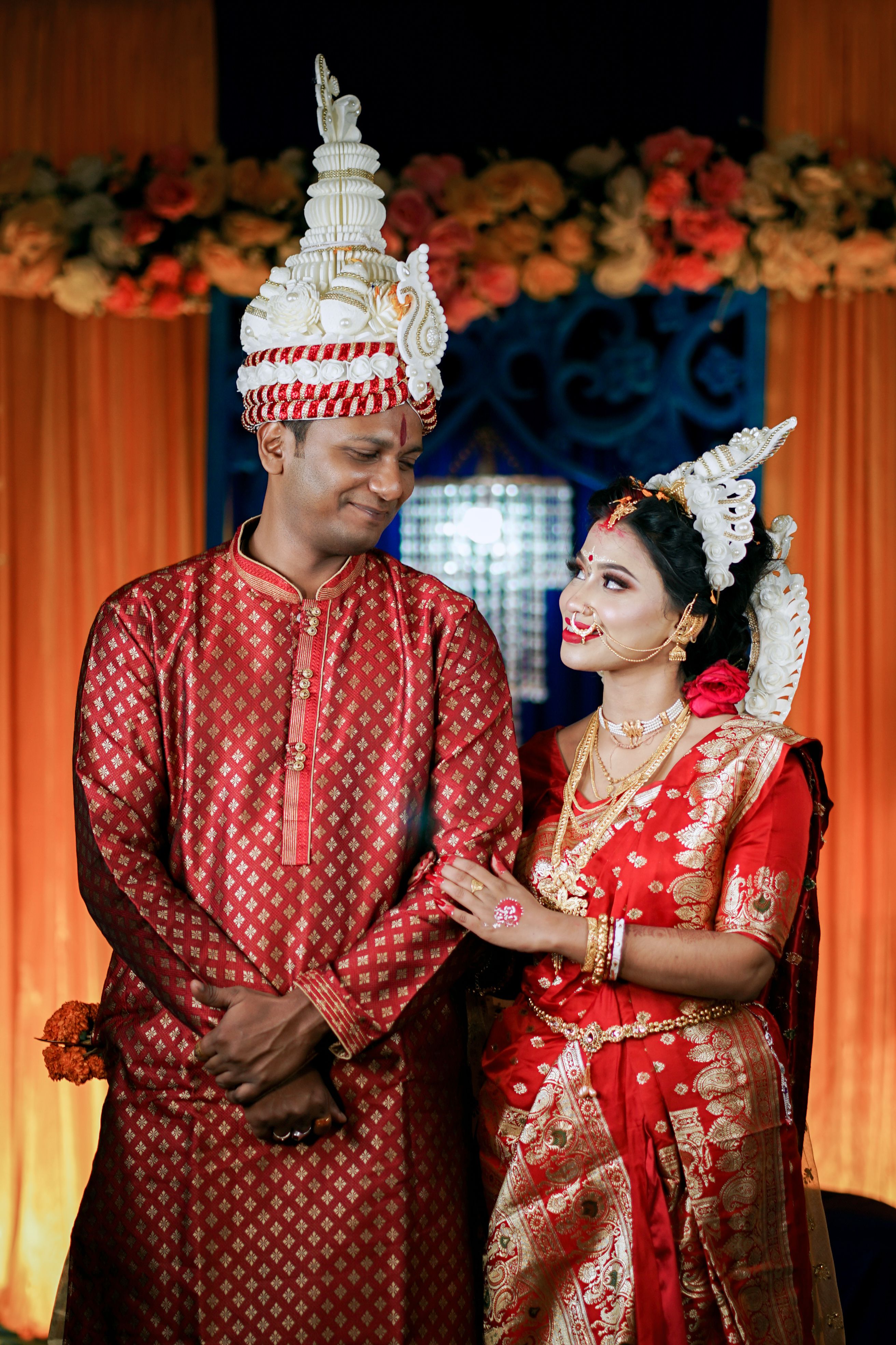 A couple in traditional indian attire posing for a photo · Free Stock Photo