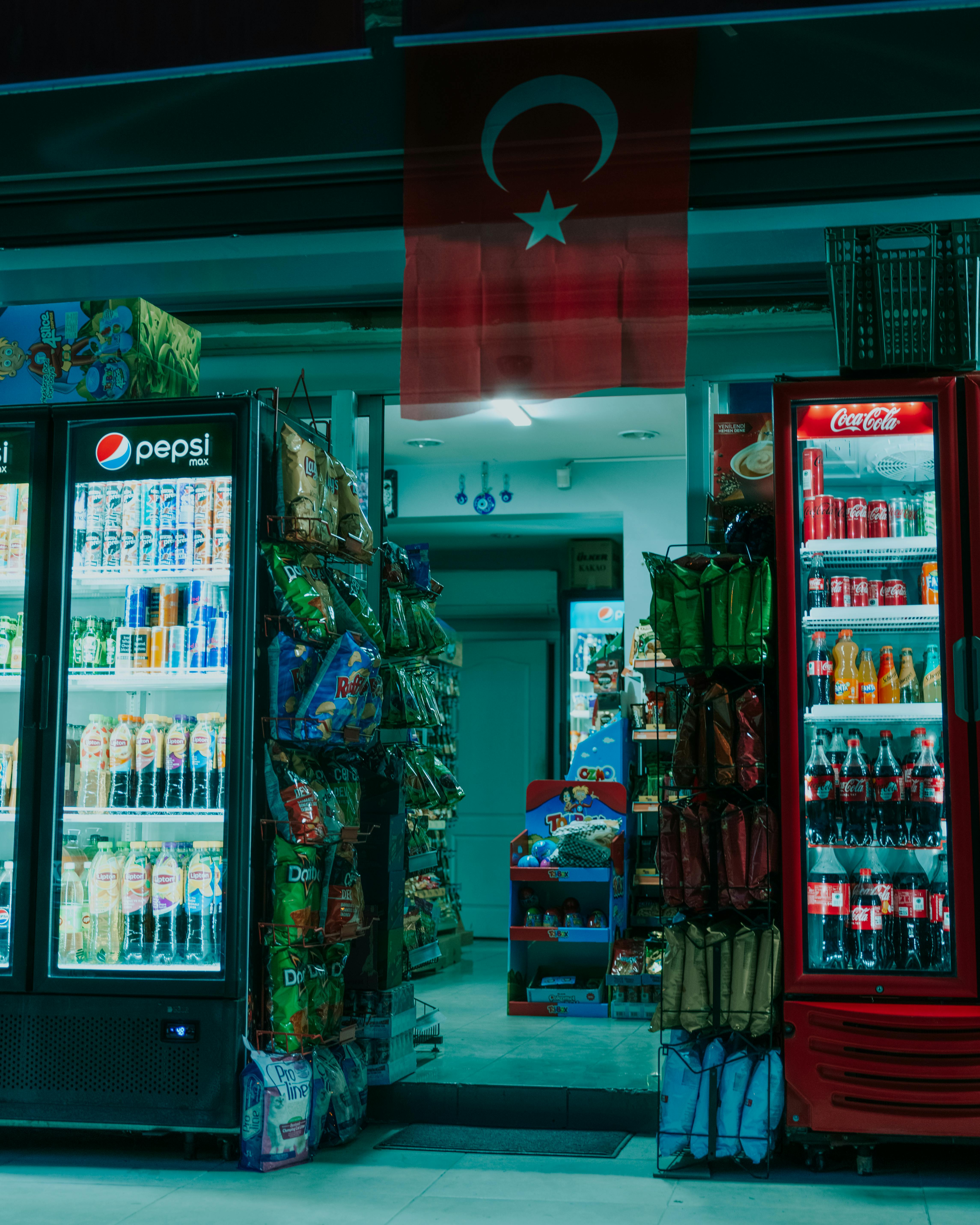 A store with a large turkish flag in the window · Free Stock Photo
