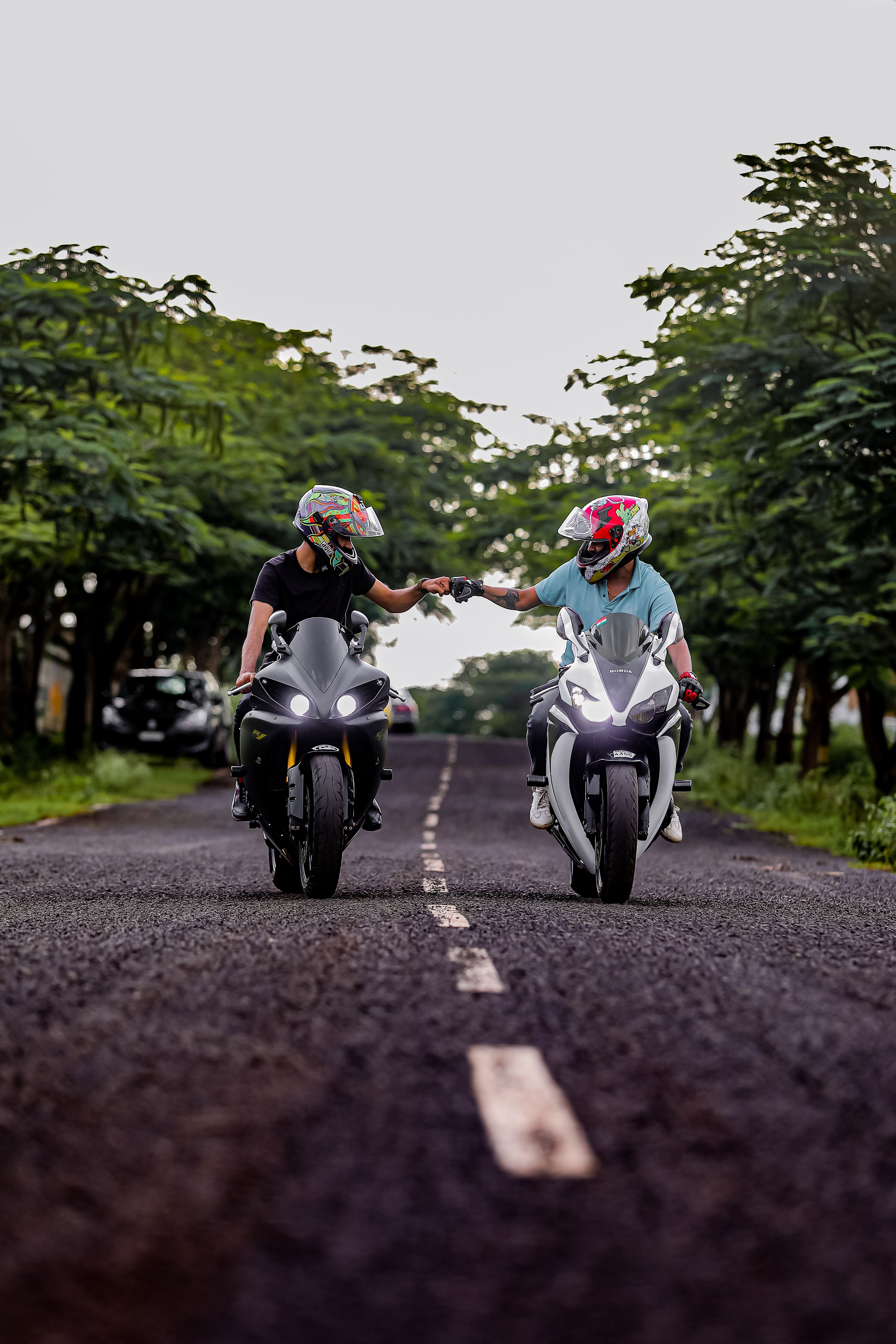 Two people on motorcycles on a road · Free Stock Photo