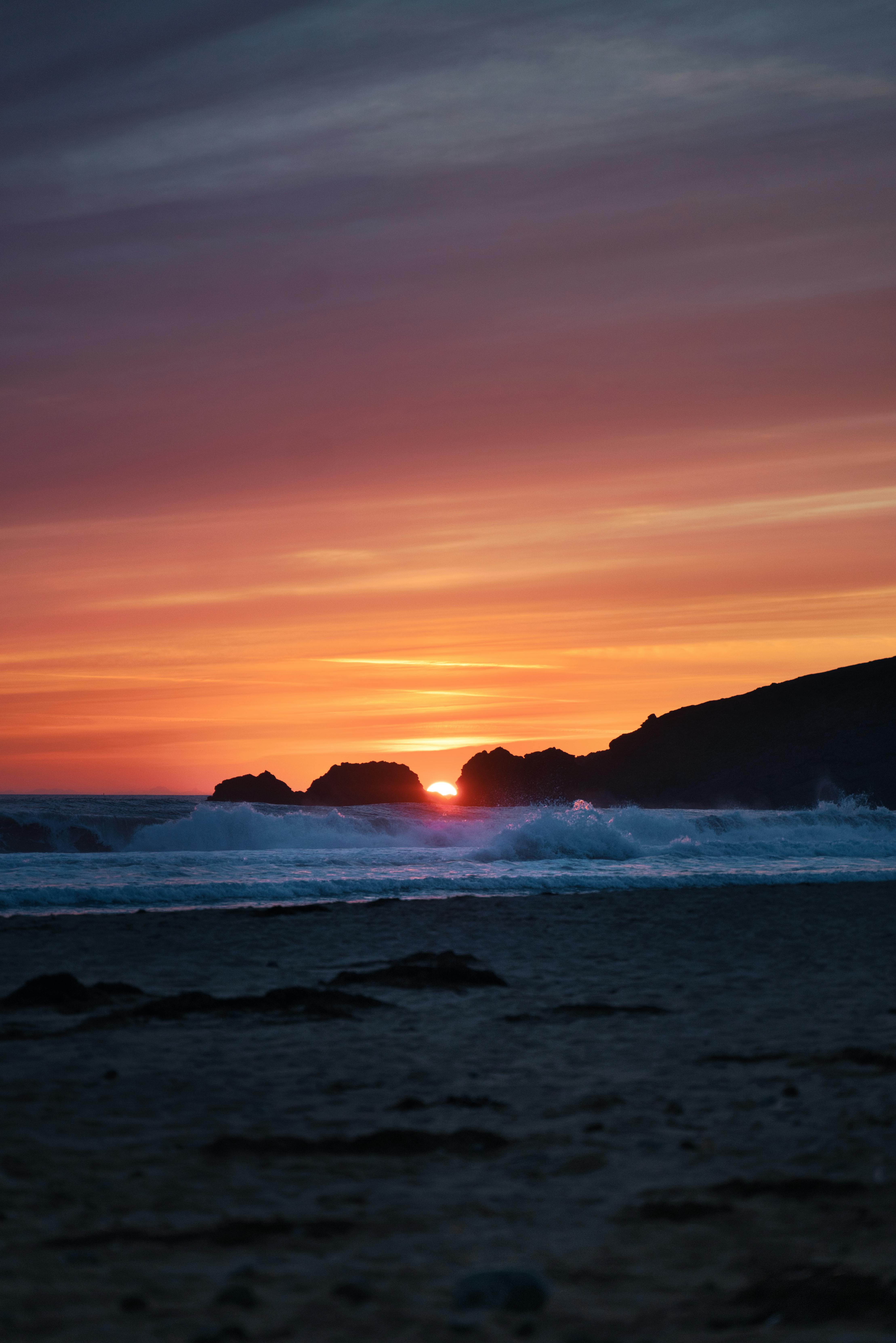 sunset between two cliffs · Free Stock Photo
