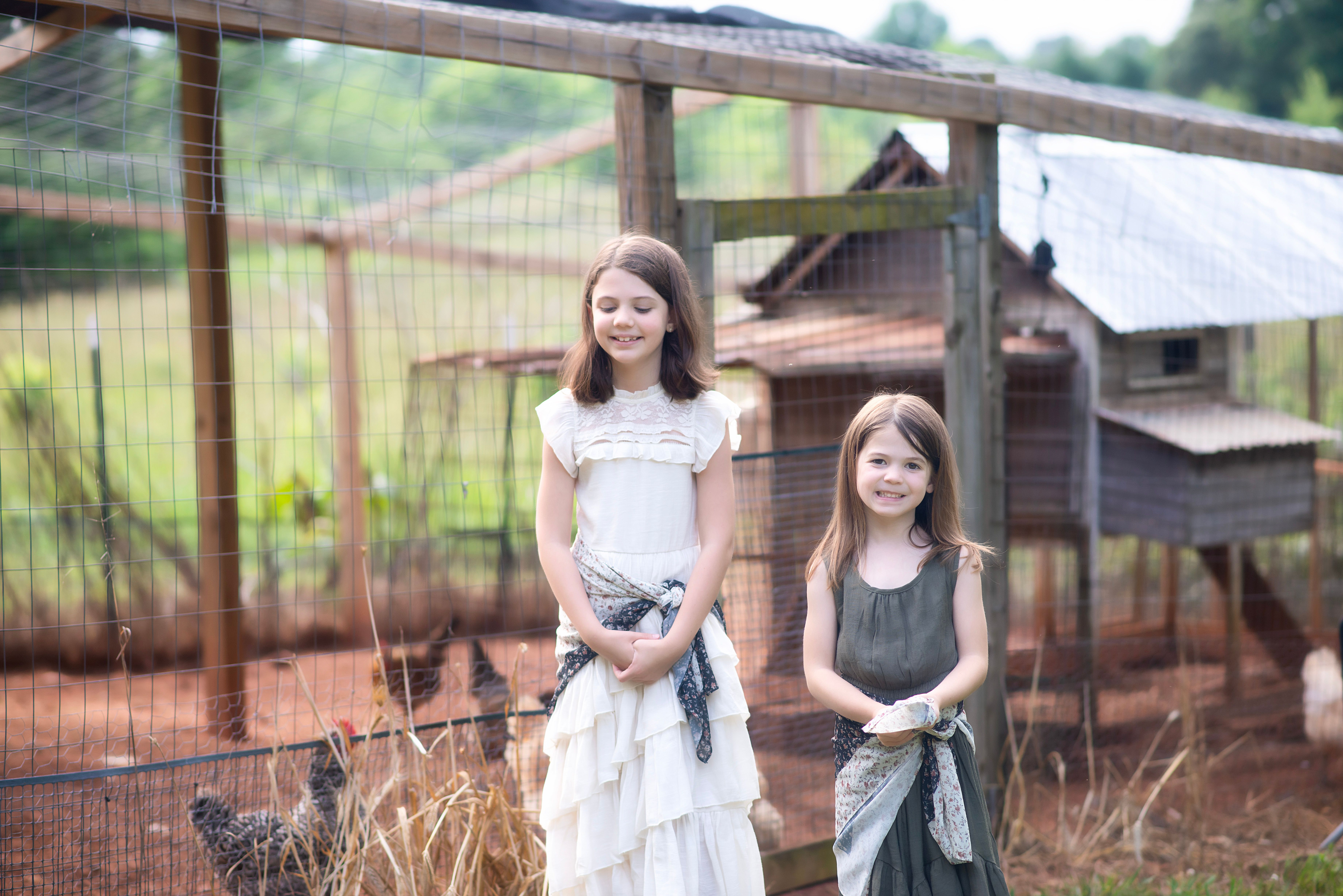 Sisters at the chicken coup · Free Stock Photo