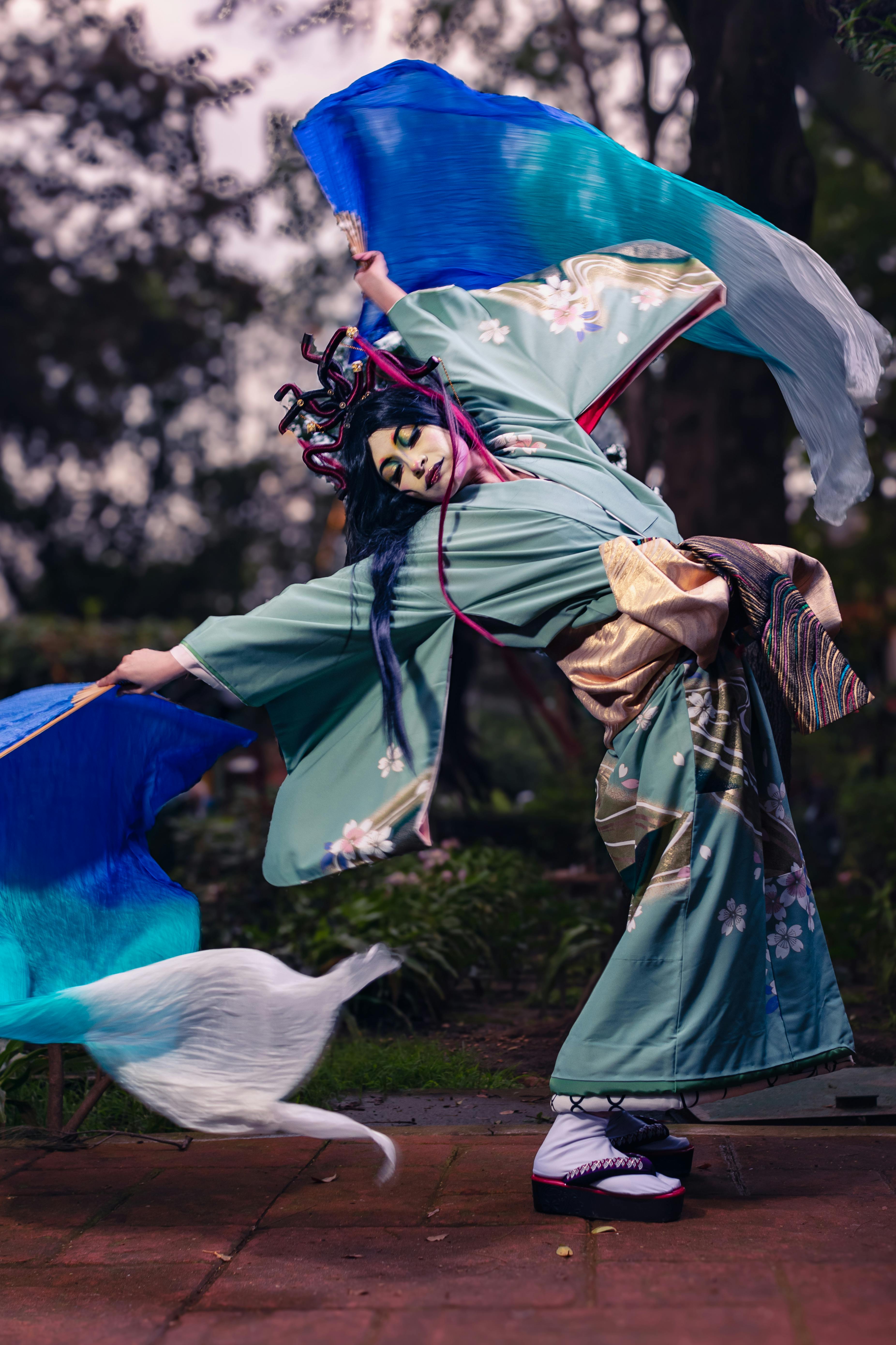 Geisha Posing in Traditional Clothing · Free Stock Photo