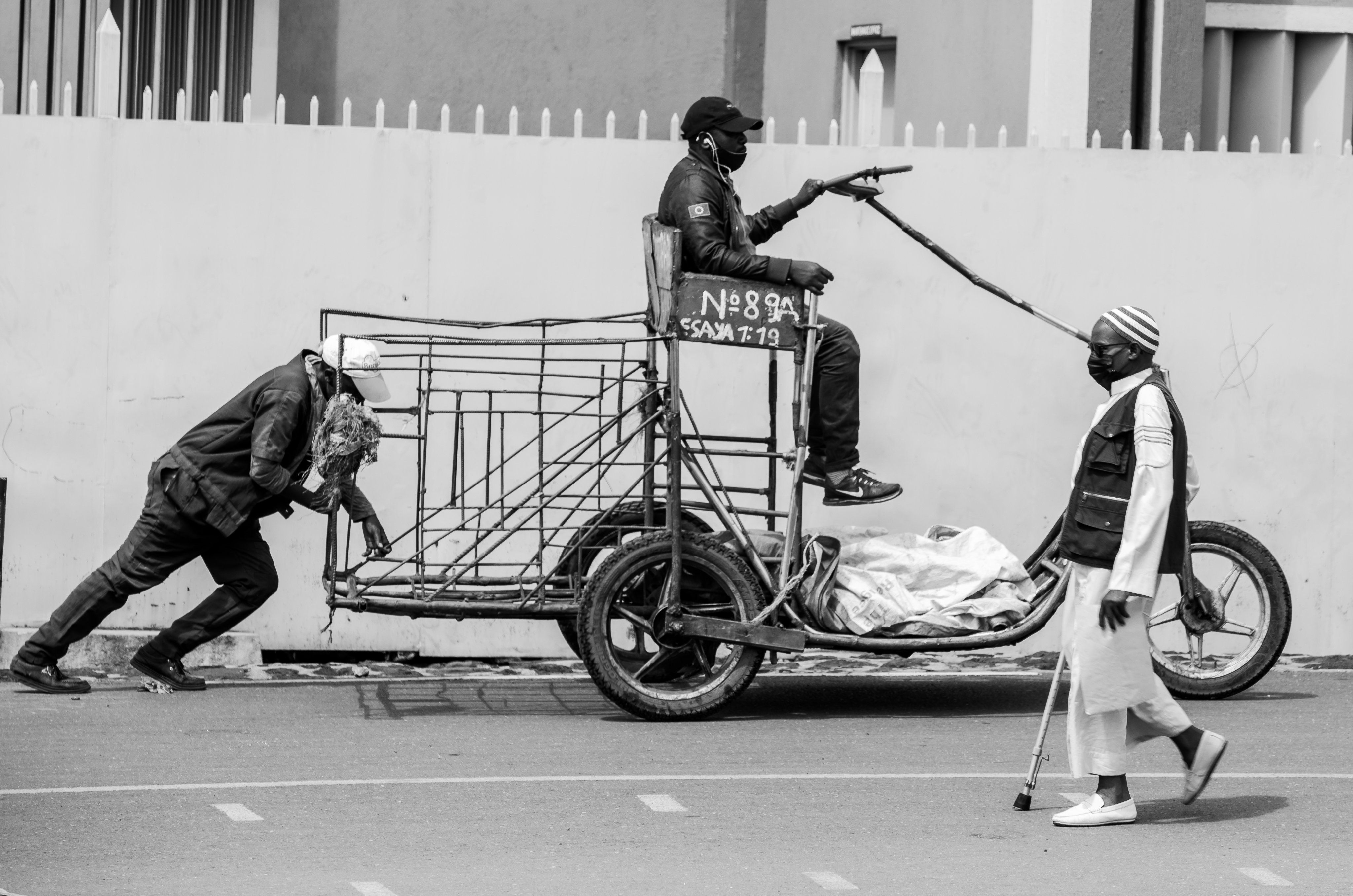 Black and White Photo of a Man Riding on a Vehicle on the Street · Free ...