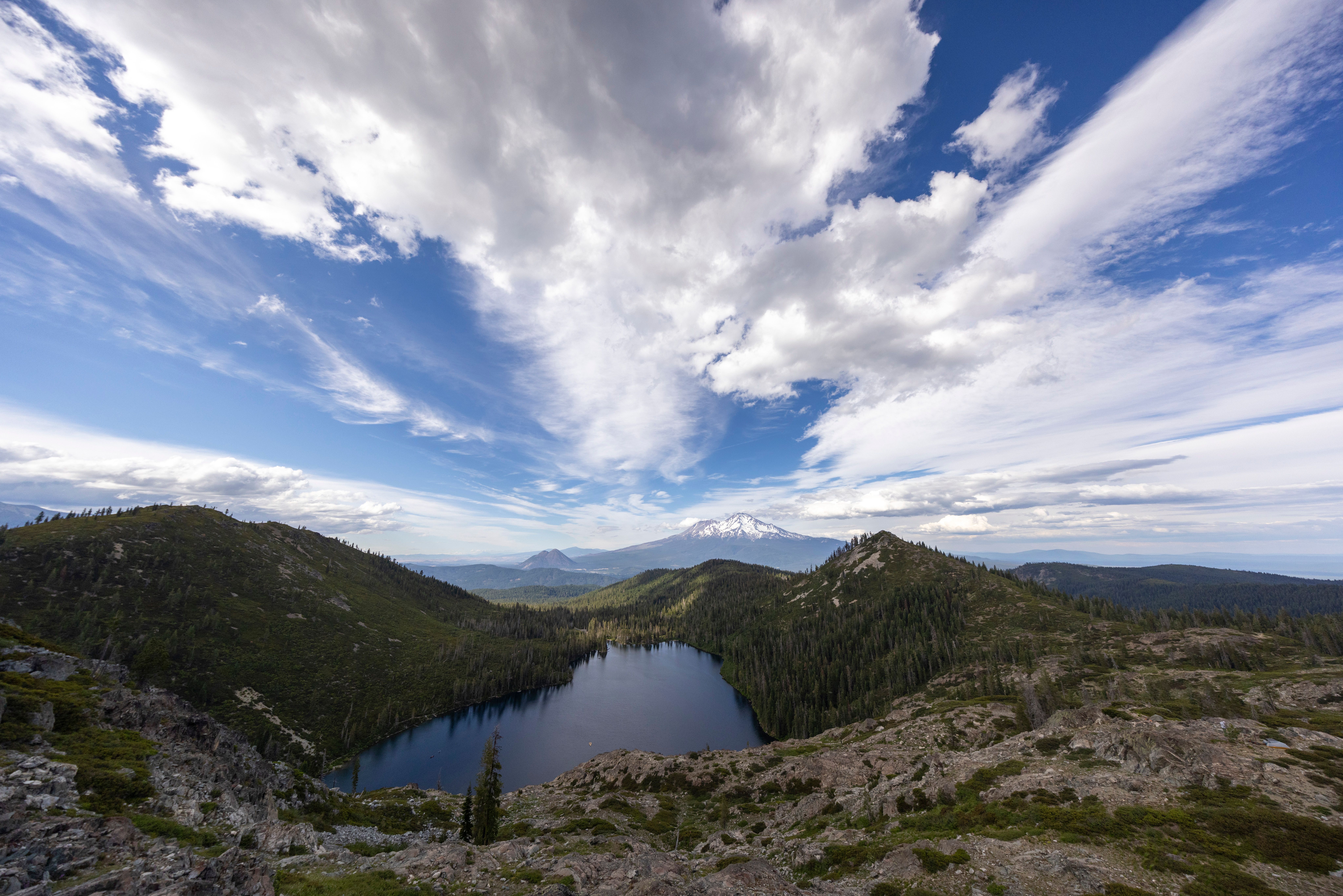 A view of a lake and mountains from above · Free Stock Photo