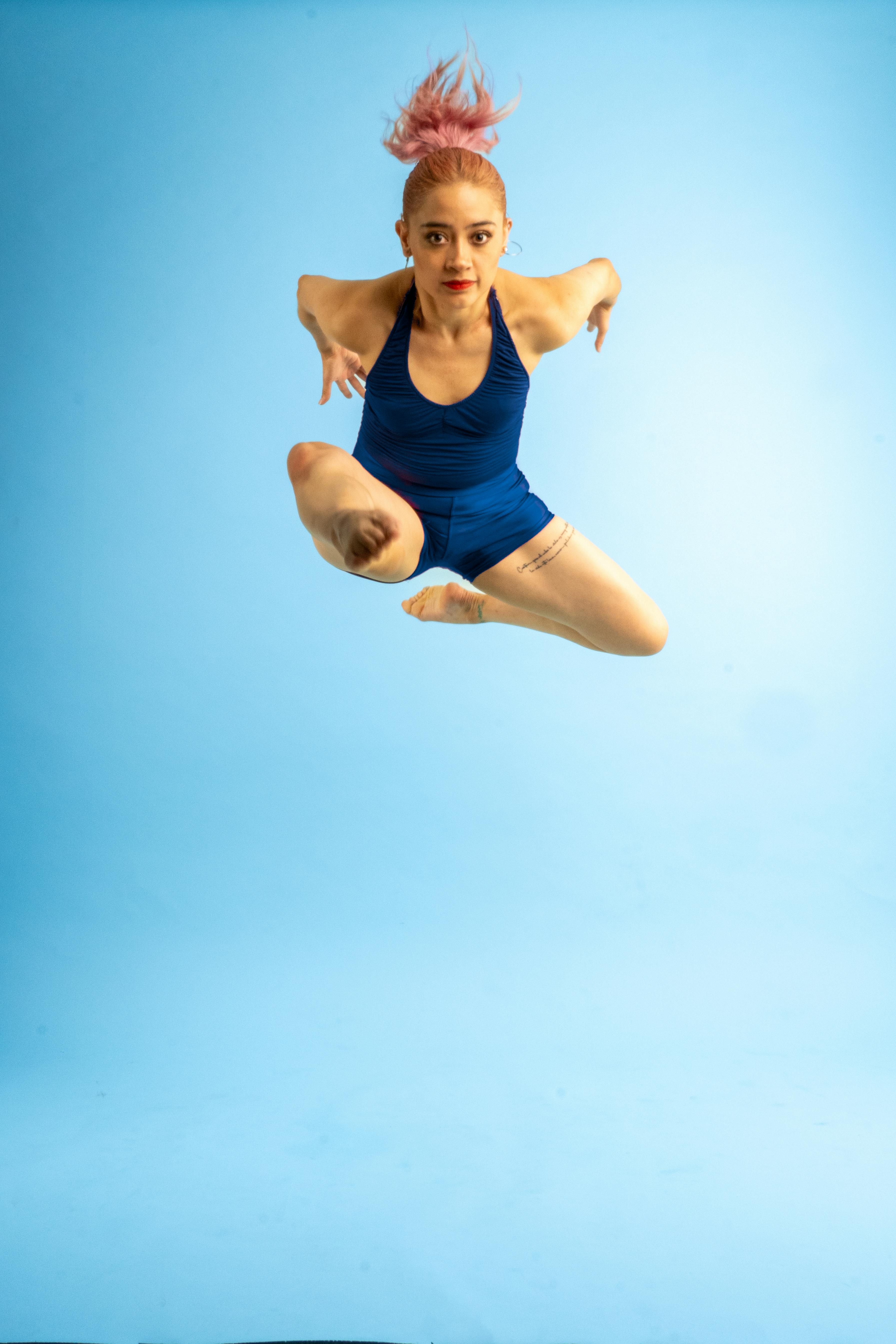 Dancing Woman Wearing Blue Vest · Free Stock Photo