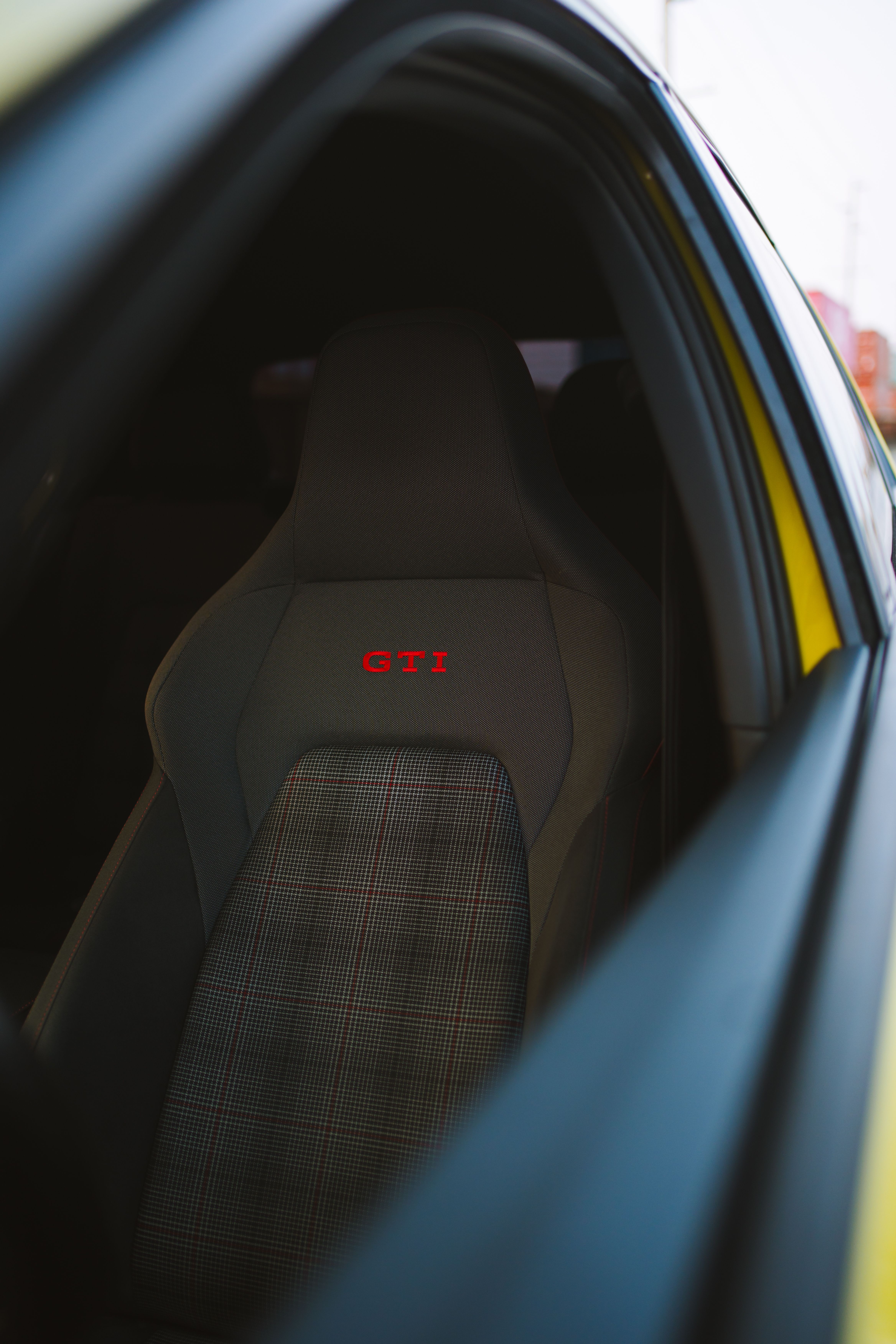 A car seat with a red and yellow checkerboard pattern · Free Stock Photo