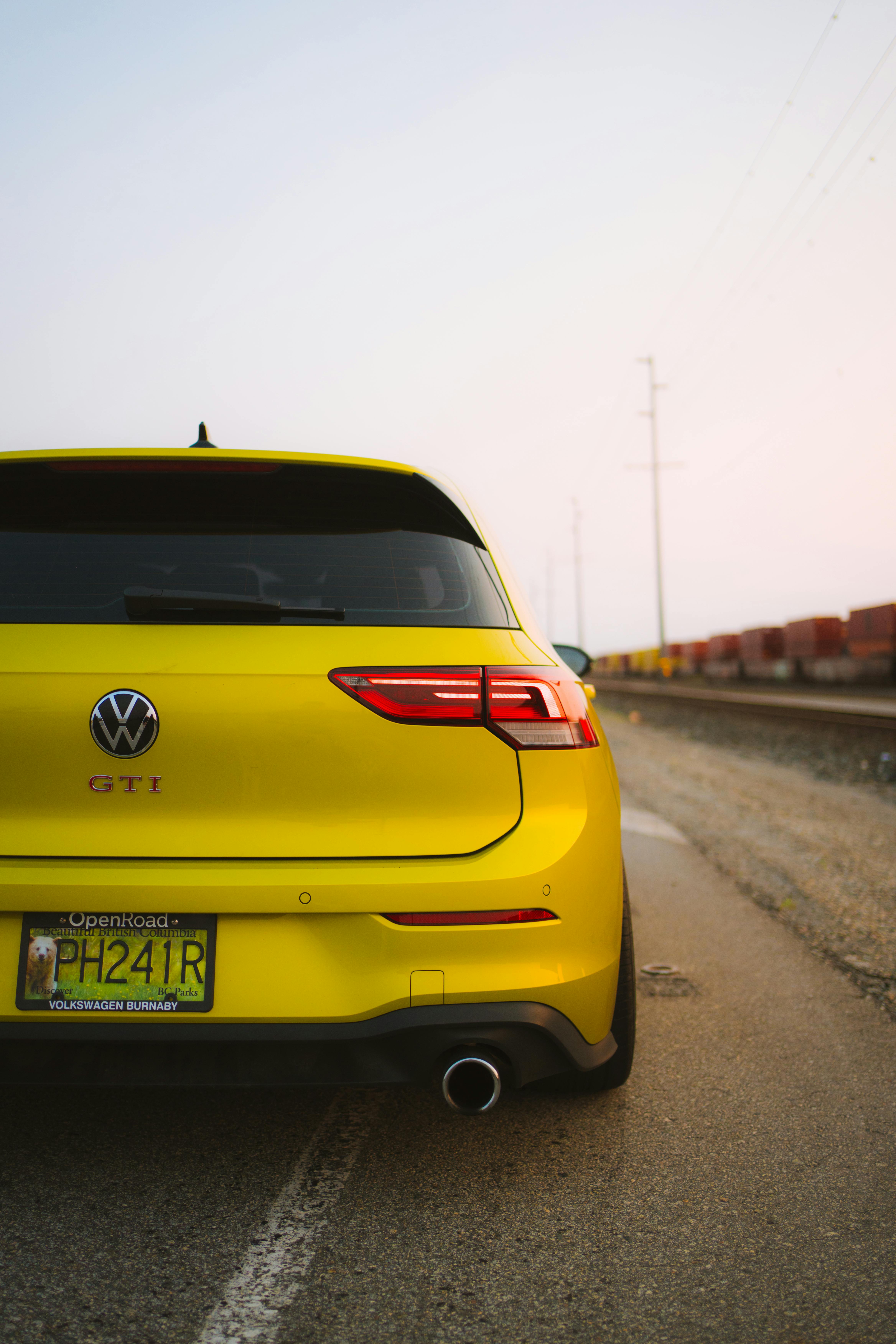 The rear end of a yellow volkswagen golf · Free Stock Photo