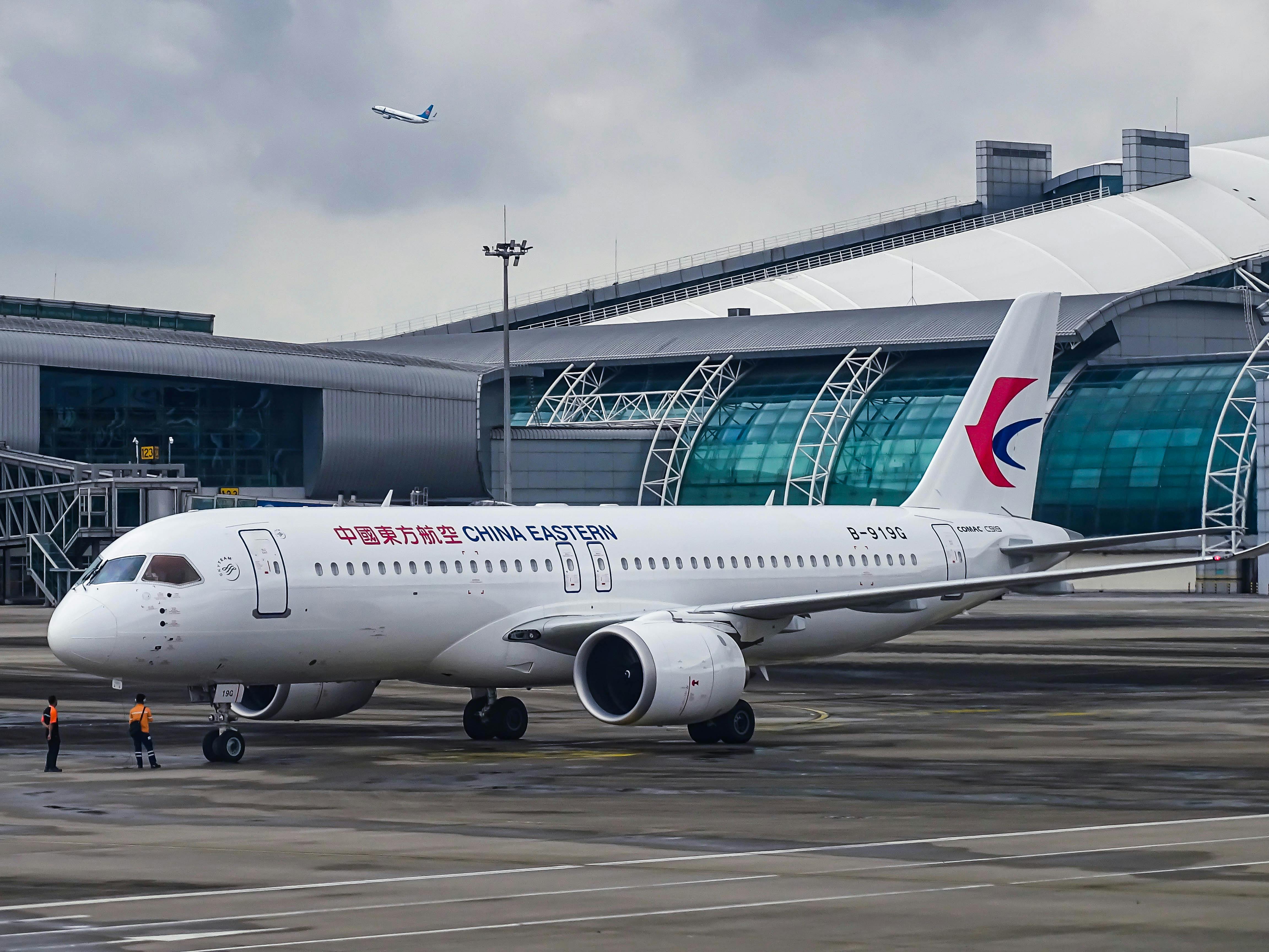 A china airways plane is parked at an airport · Free Stock Photo